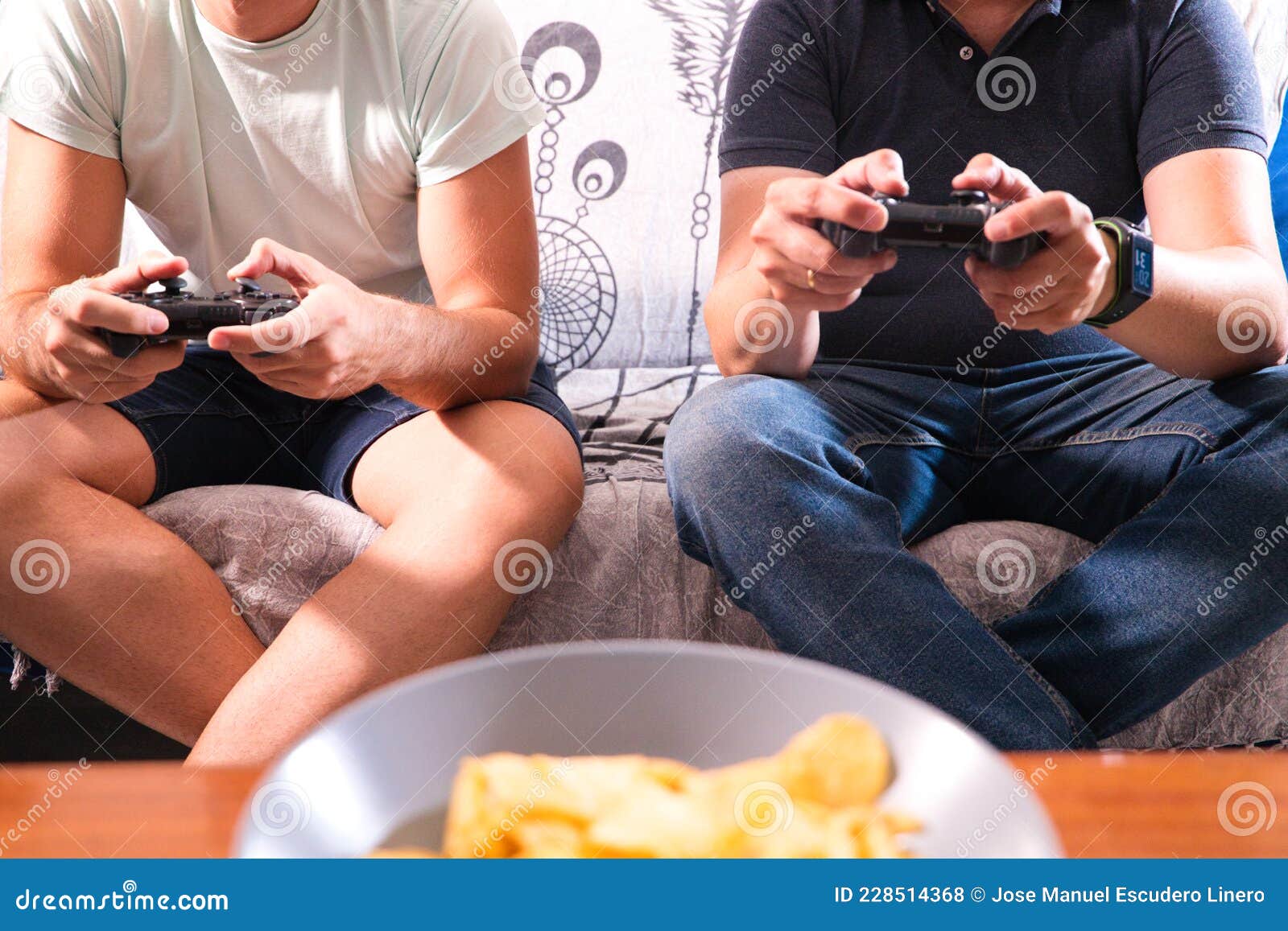 Details of Hands of Two Friends Holding the Controller of a Video ...