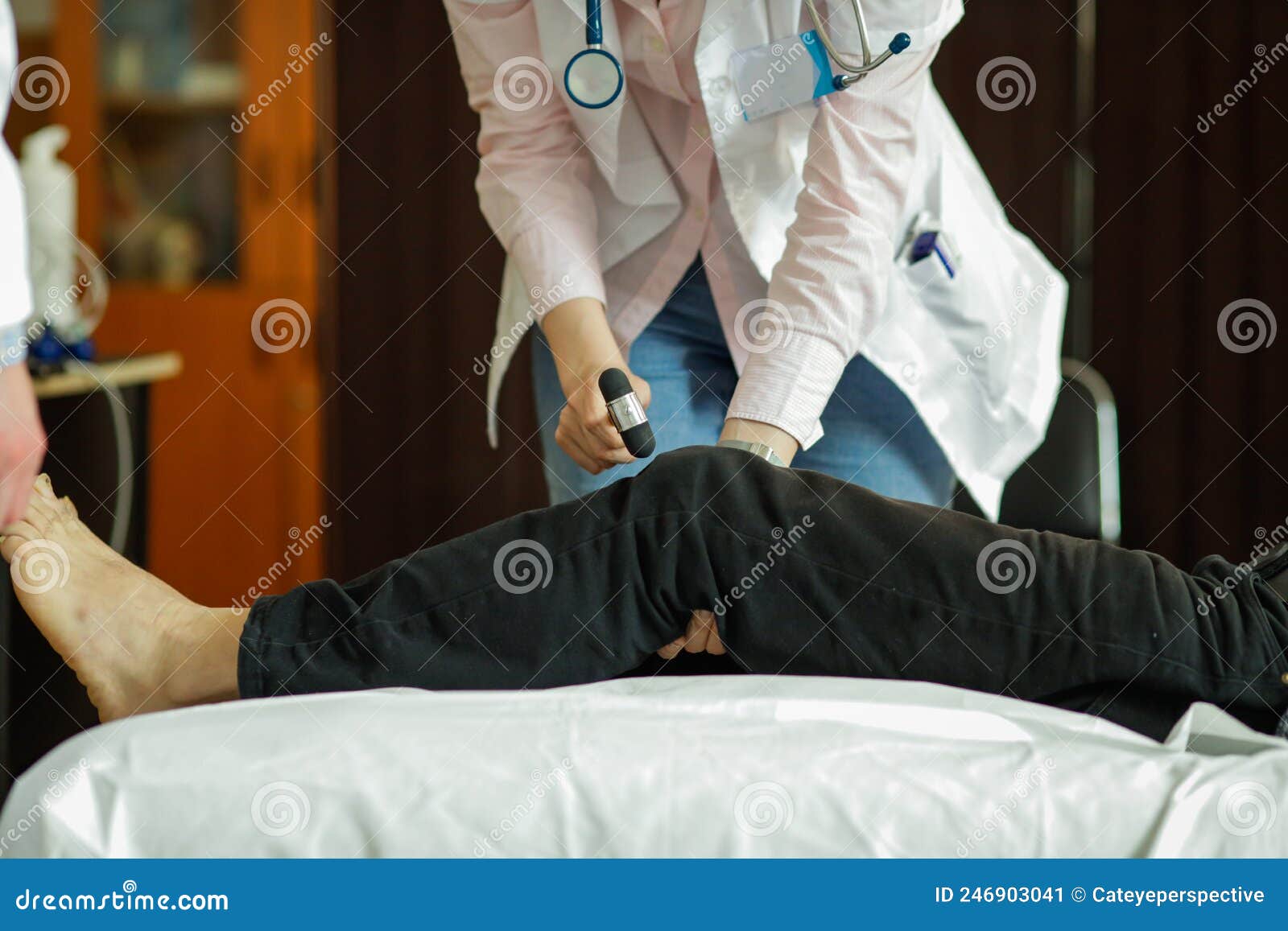 Details with the Hands of a Young Female Medic Testing the Knee ...