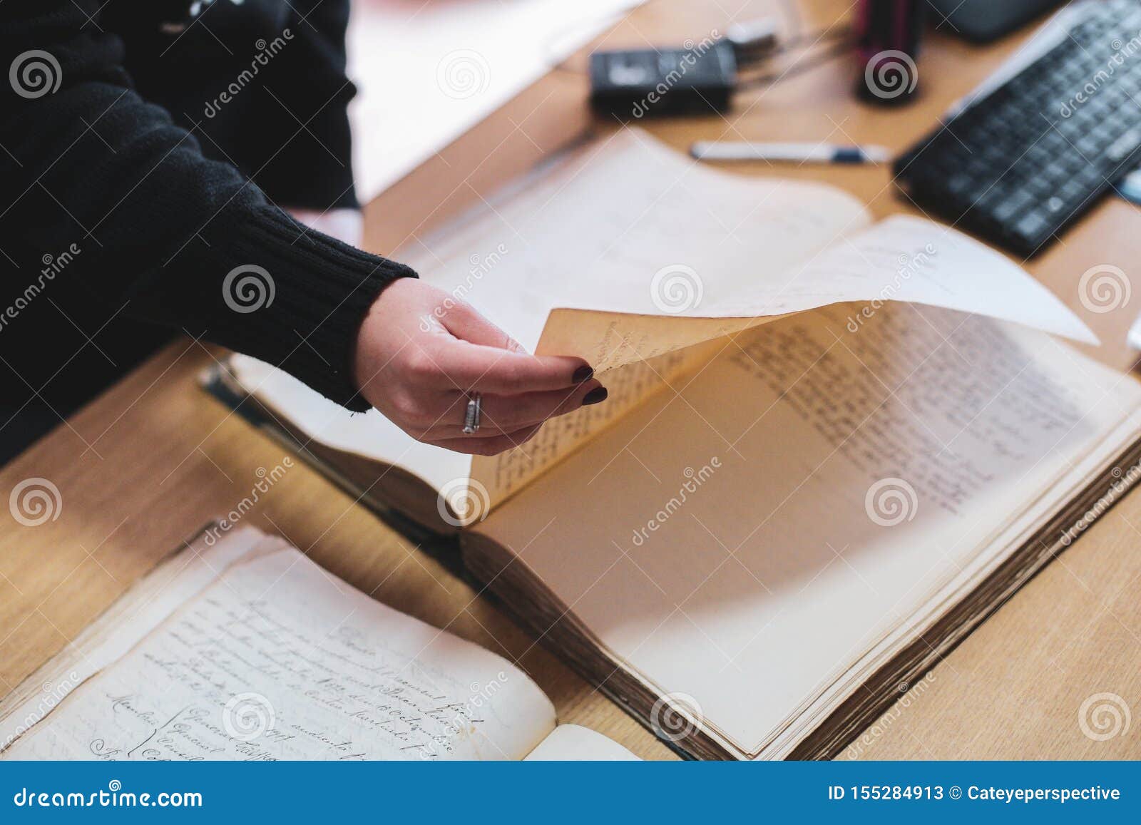 Details with the Hands of a Young Woman Reading an Archive Document ...