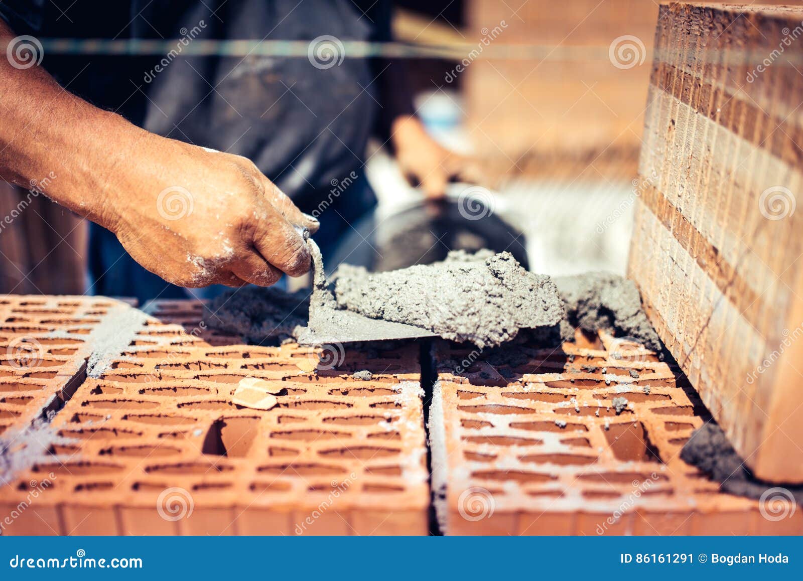 Details of Industrial Bricklayer Installing Bricks on Construction Site ...
