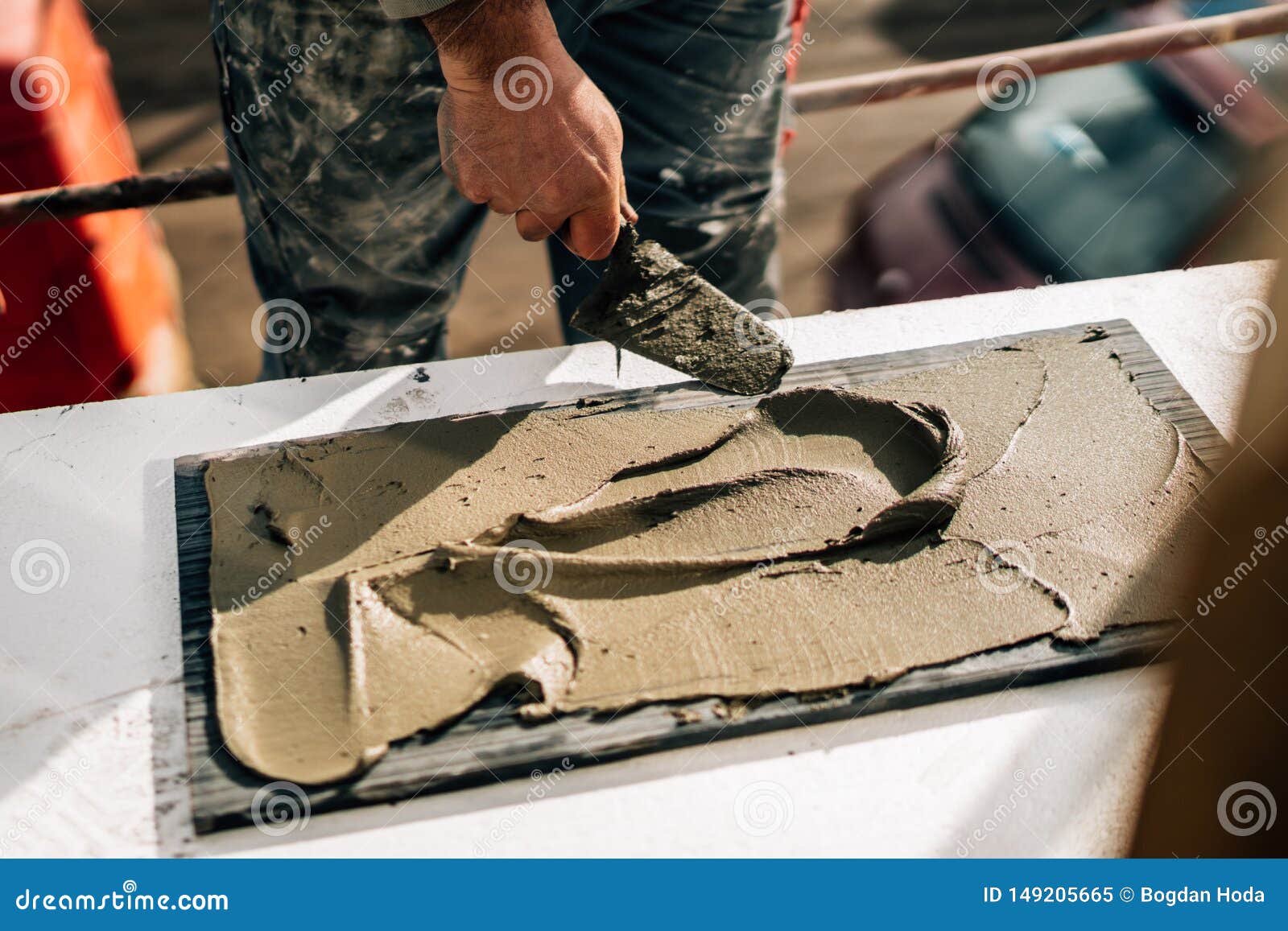 Details of Industrial Worker Using Mortar for Stone Installation on ...