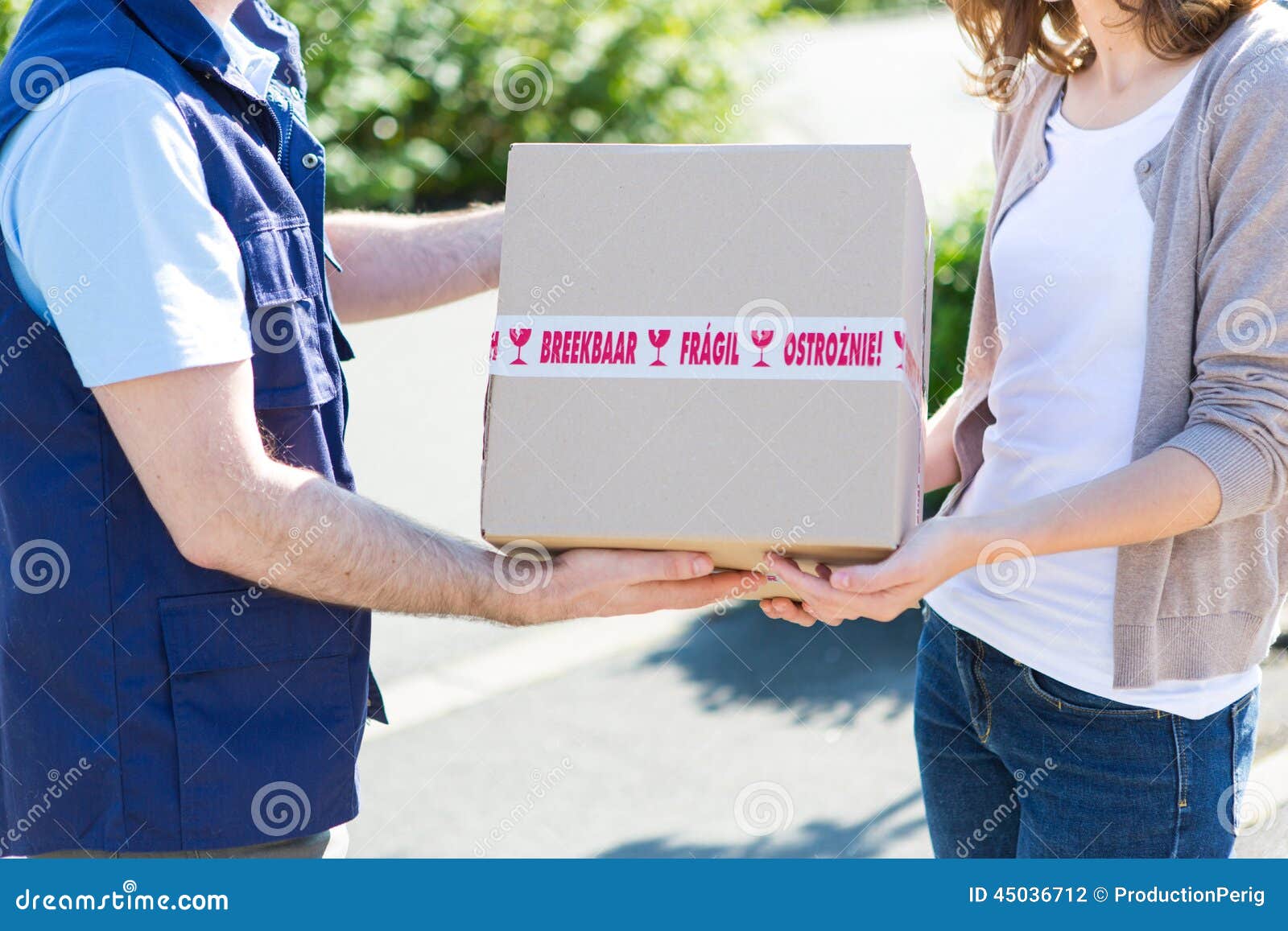 Details of Parcel Being Handed Over by a Professional Stock Photo ...