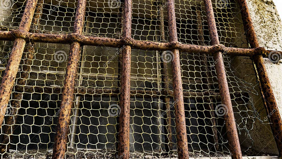 Rusty bars of a jail stock photo. Image of link, building - 118571418