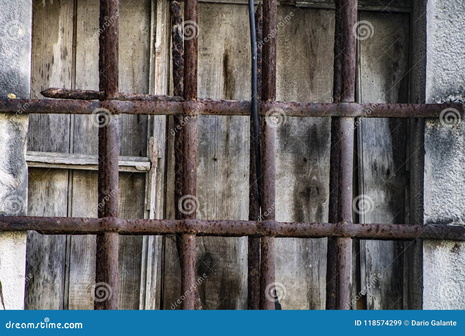 Rusty bars of a jail stock image. Image of locked, catch - 118574299