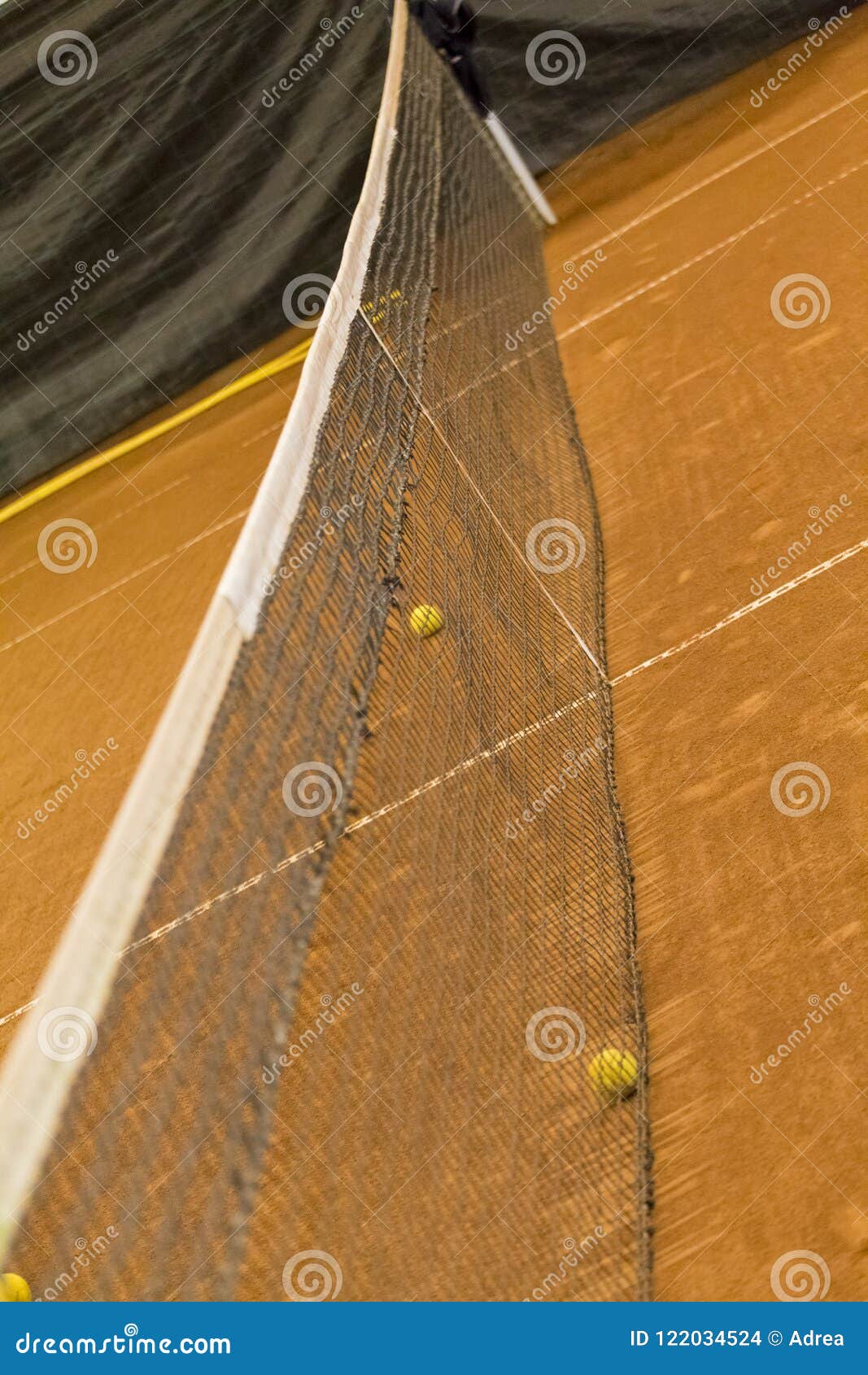 Tennis Balls Near a Tennis Net at the Middle of the Tennis Field Stock ...