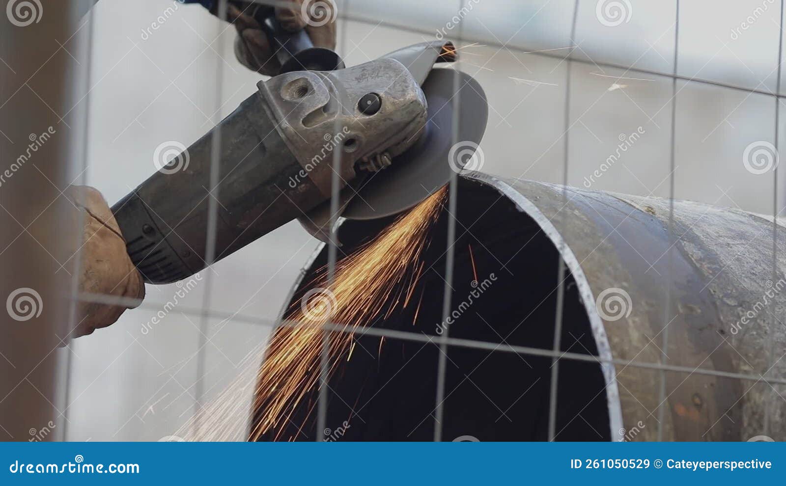 Details with a Worker Using an Angle Grinder on an Industrial Metallic ...