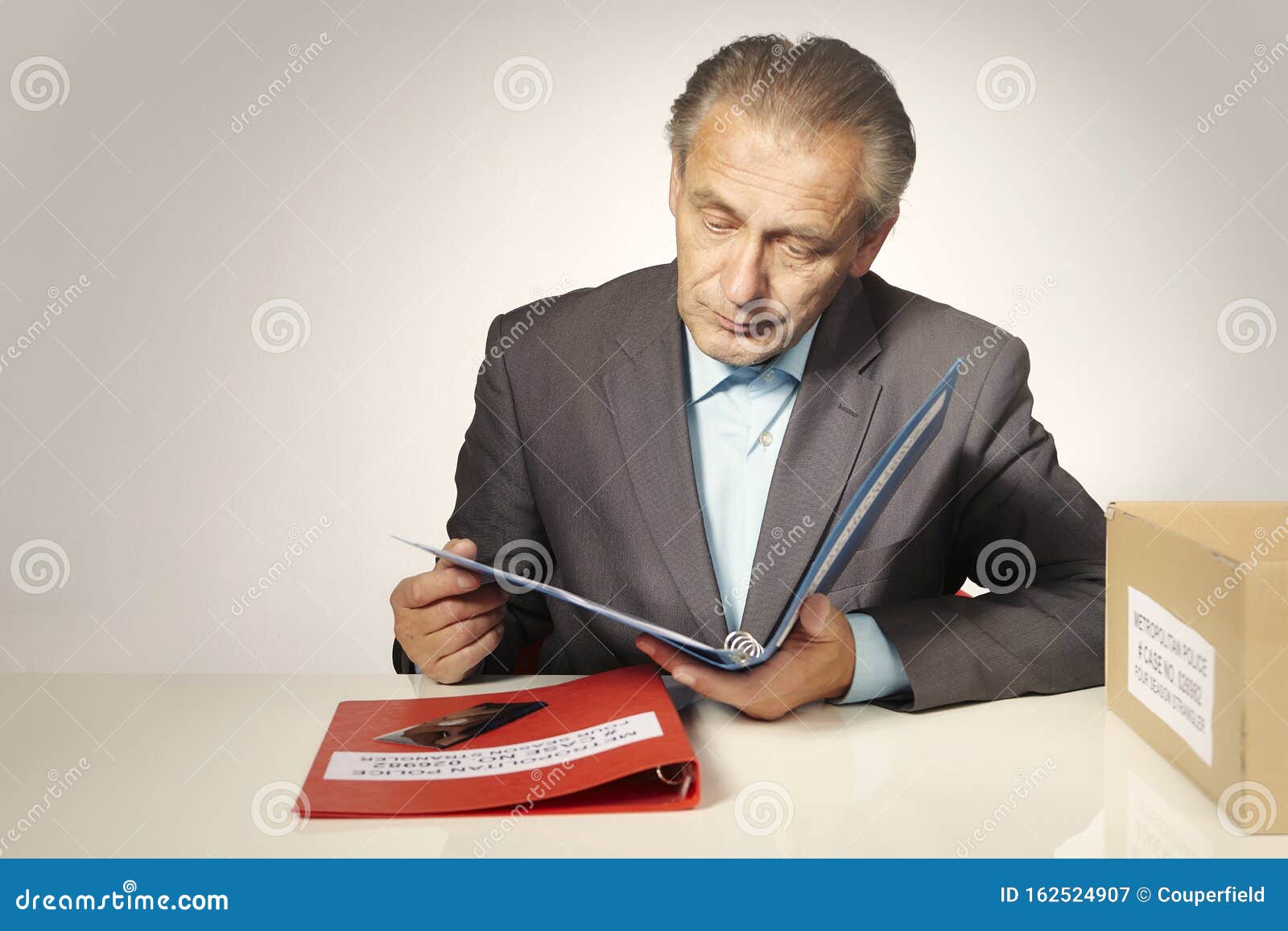 Detective Agent Studying Case and Documentation and Evidences Stock ...