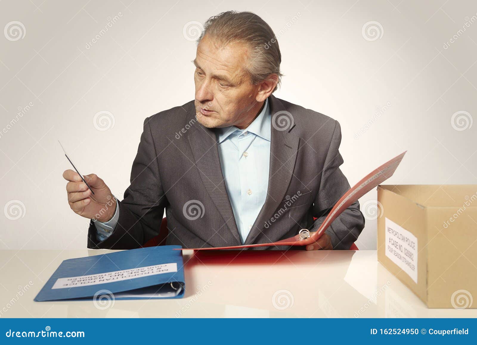 Detective Agent Studying Case and Documentation and Evidences Stock ...