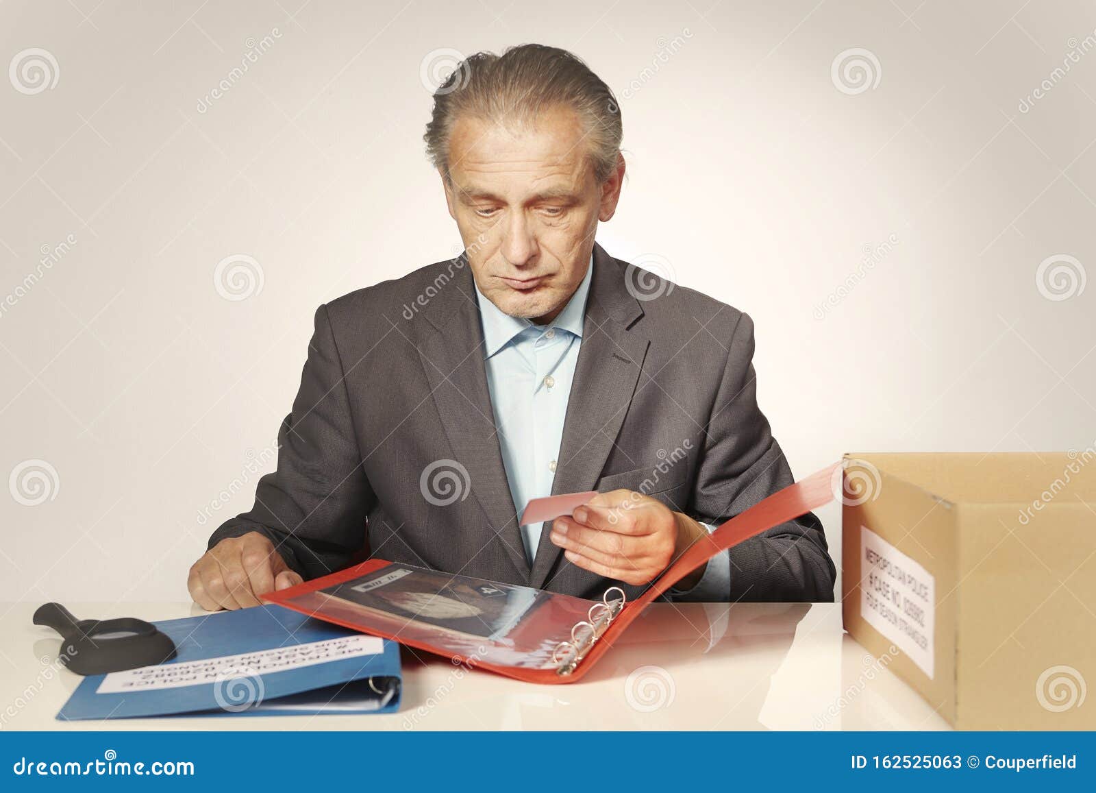 Detective Agent Studying Case and Documentation and Evidences Stock ...