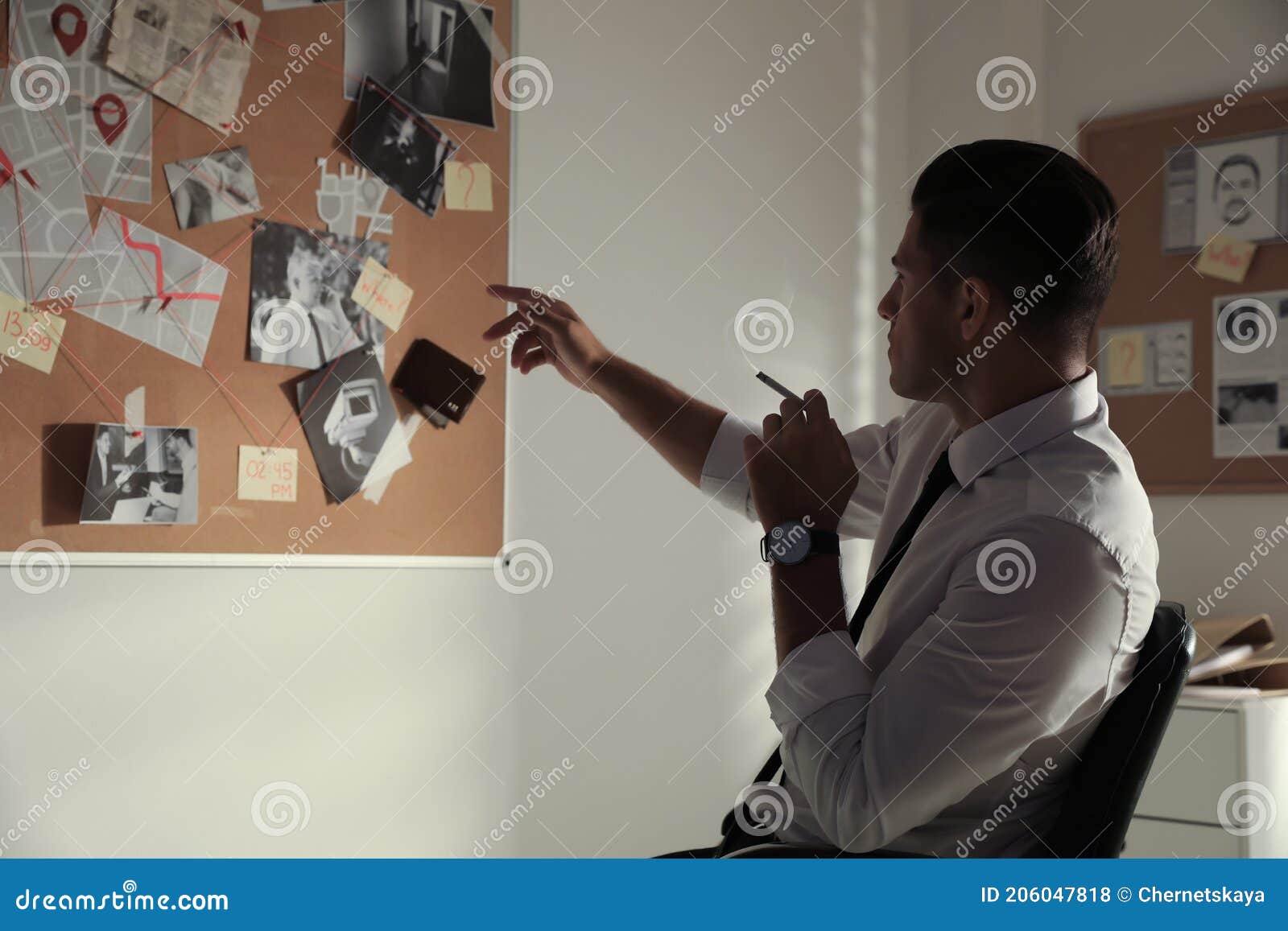 Detective Looking at Evidence Board in Office Stock Photo - Image of ...