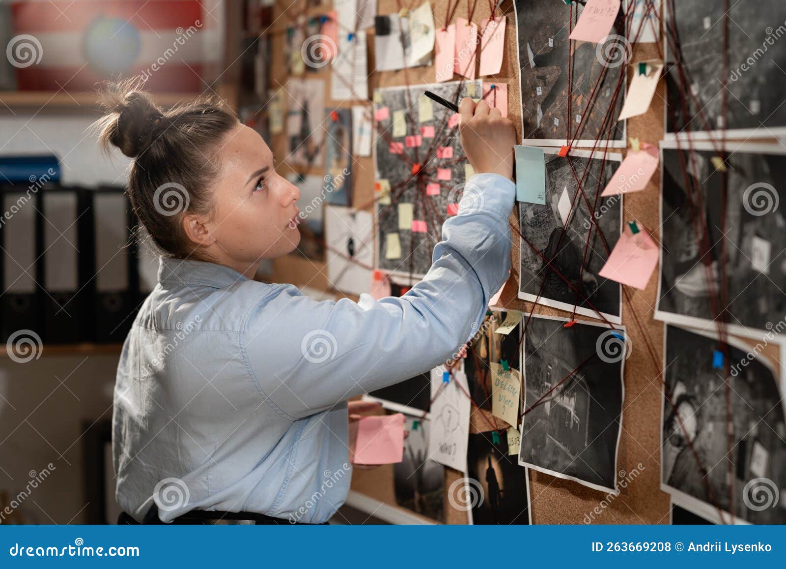 Detective Looking at Evidence Board in Her Office Stock Photo - Image ...