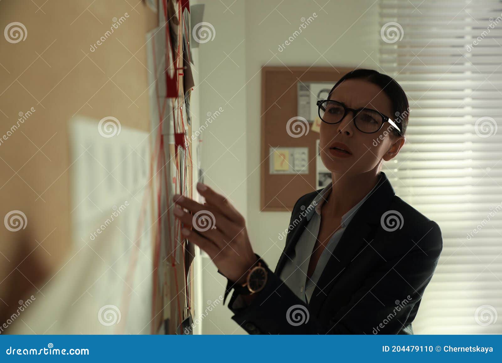 Detective Looking at Evidence Board in Office Stock Photo - Image of ...