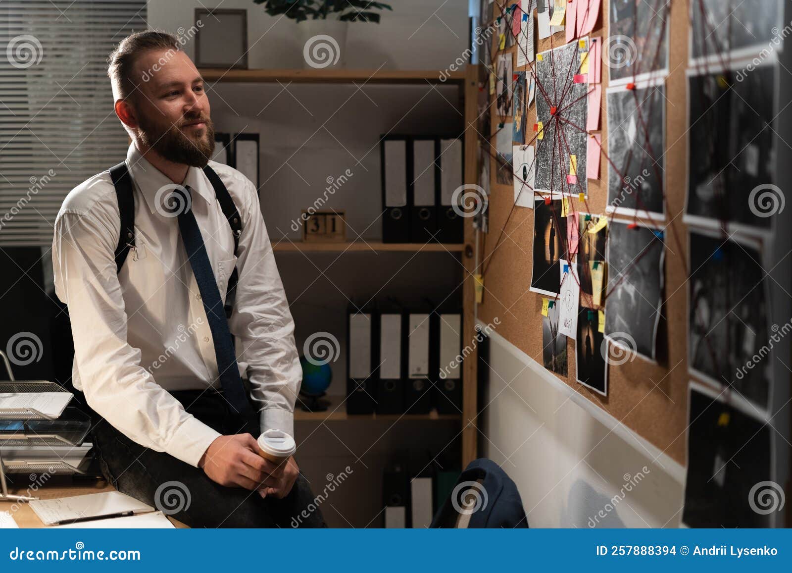 Detective Looking at Evidence Board with Photos in Office, Working at ...