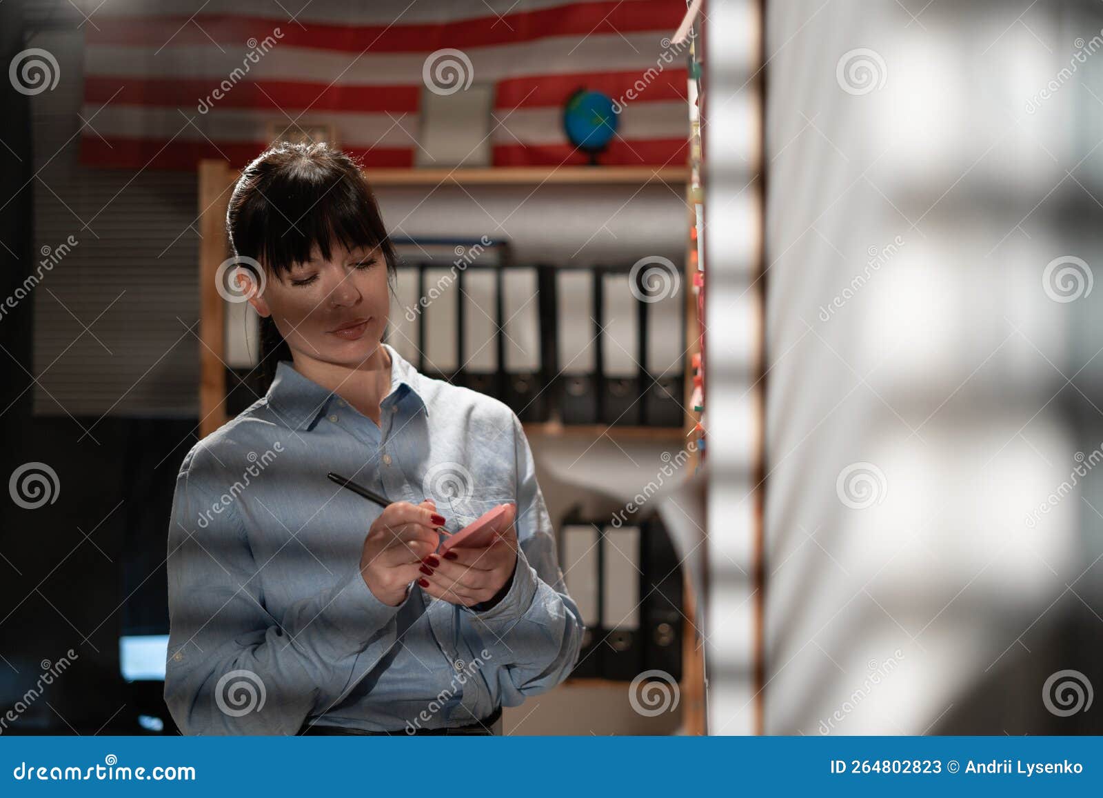 Detective Looking at Investigation Board Making Notes on Criminal Case ...