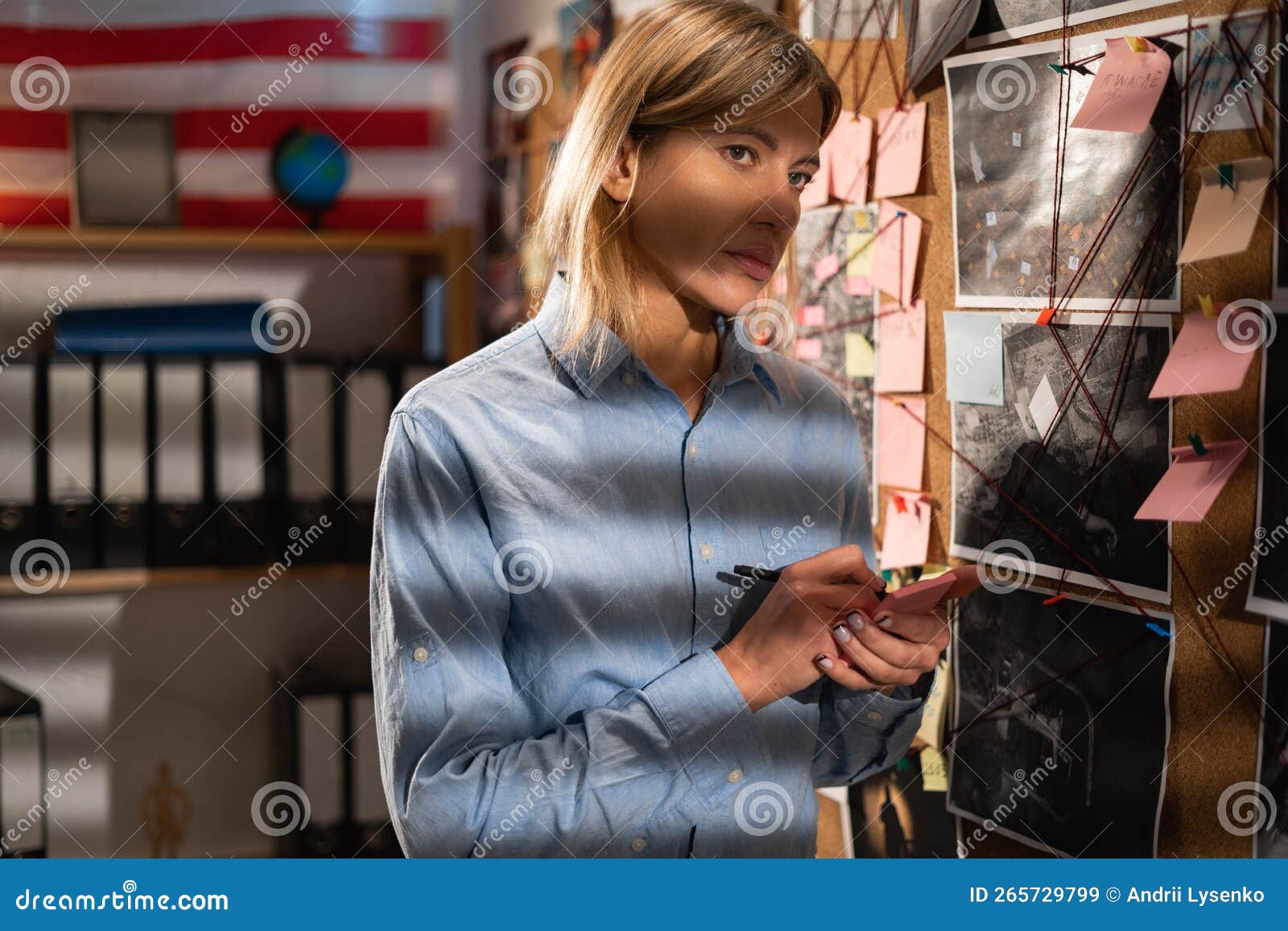 Detective Looking at Investigation Board Making Notes on Criminal Case ...