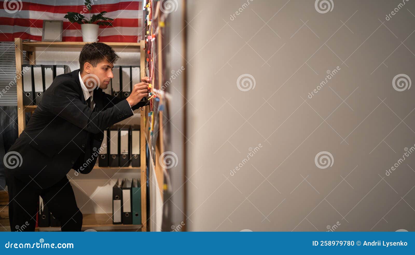 Detective Looking at Investigation Board, Searching for Solution ...