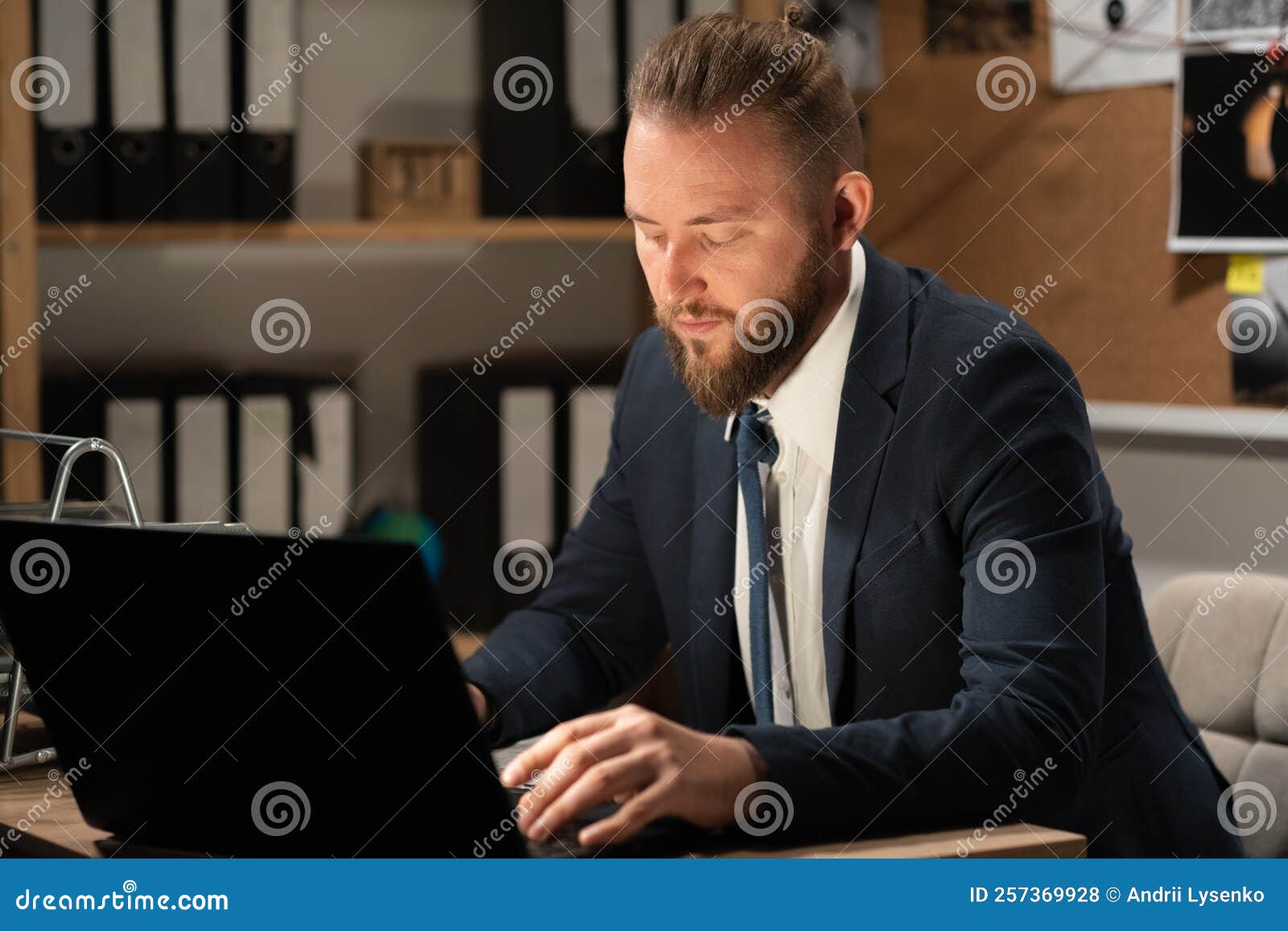 Detective Processing Evidence in Office Using Computer Working at Desk ...