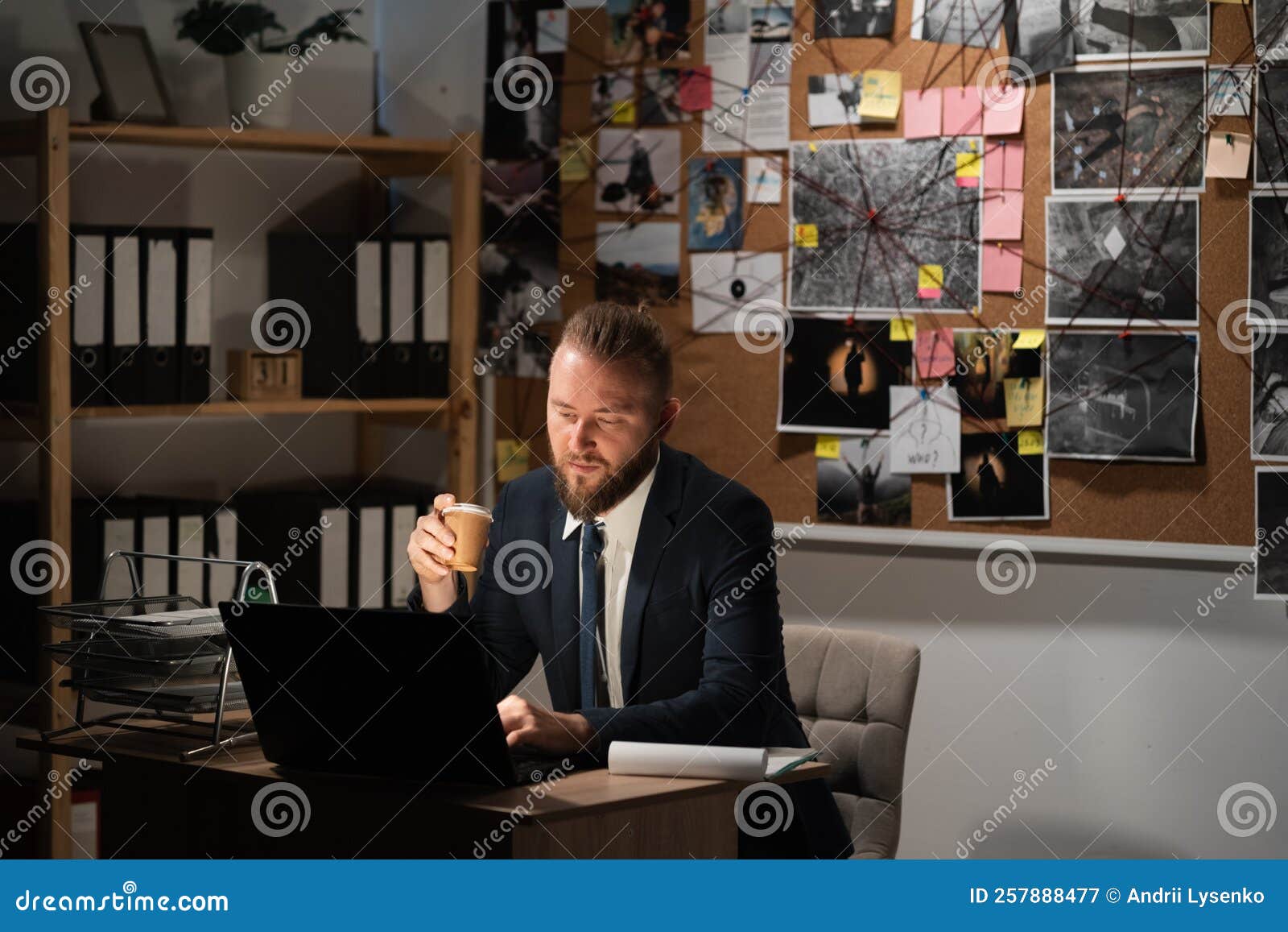 Detective Processing Evidence in Office, Working at Desk Using Laptop ...