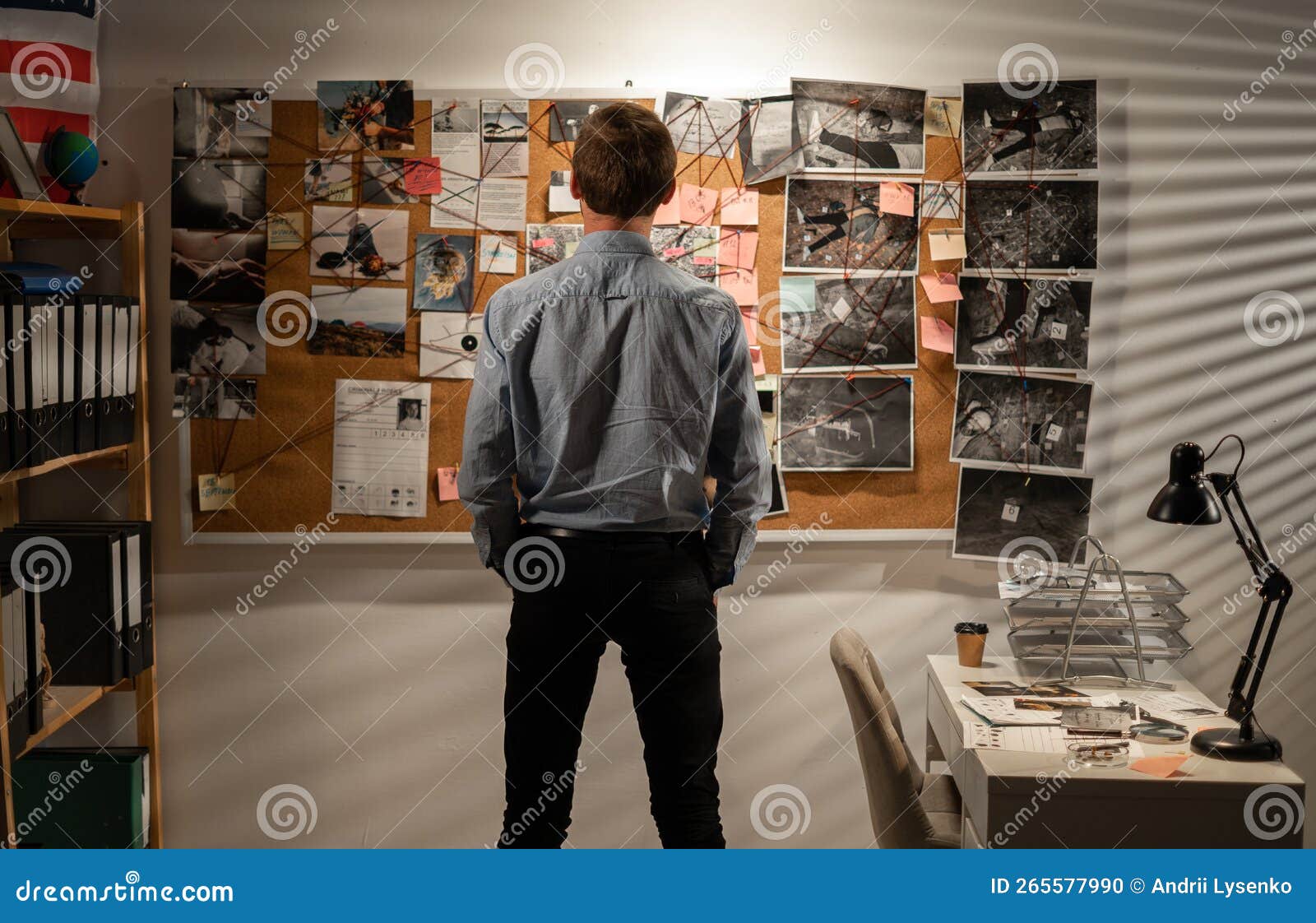 Detective Searching for Solution and Looking at Investigation Board ...