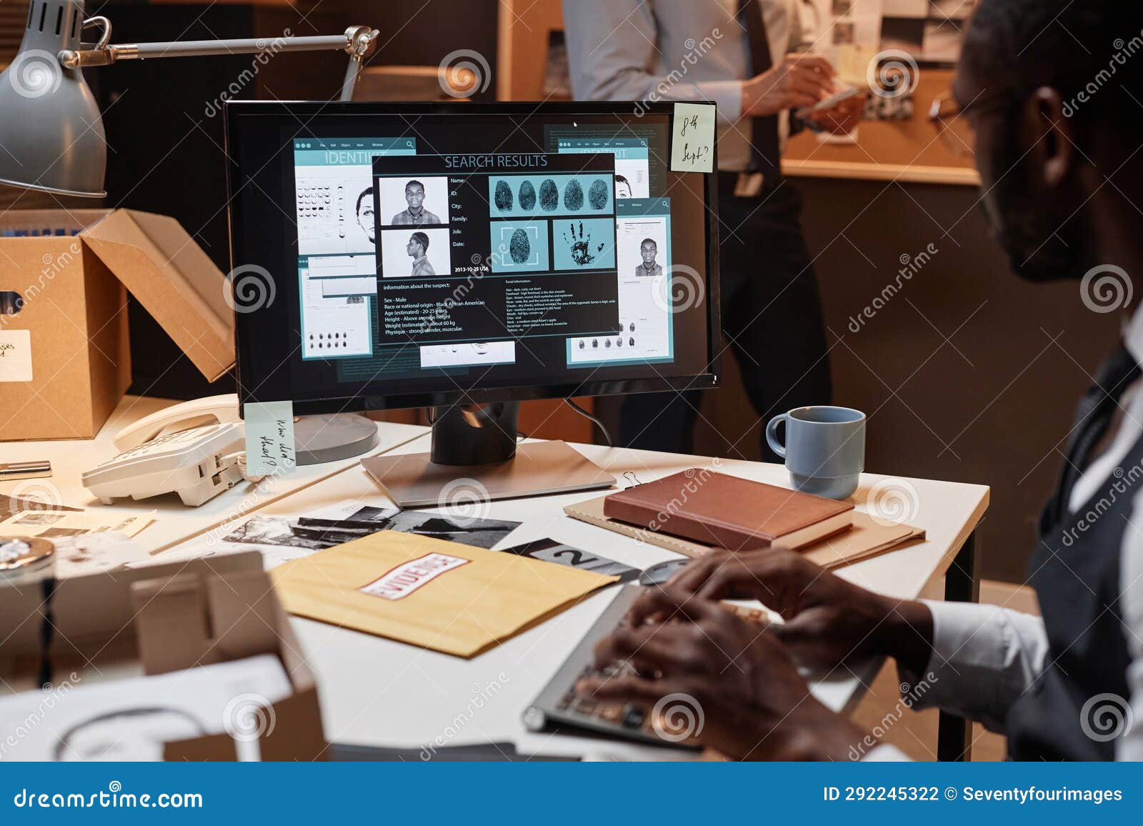 Detective Using Computer at Workplace with Personal Profile on Screen ...