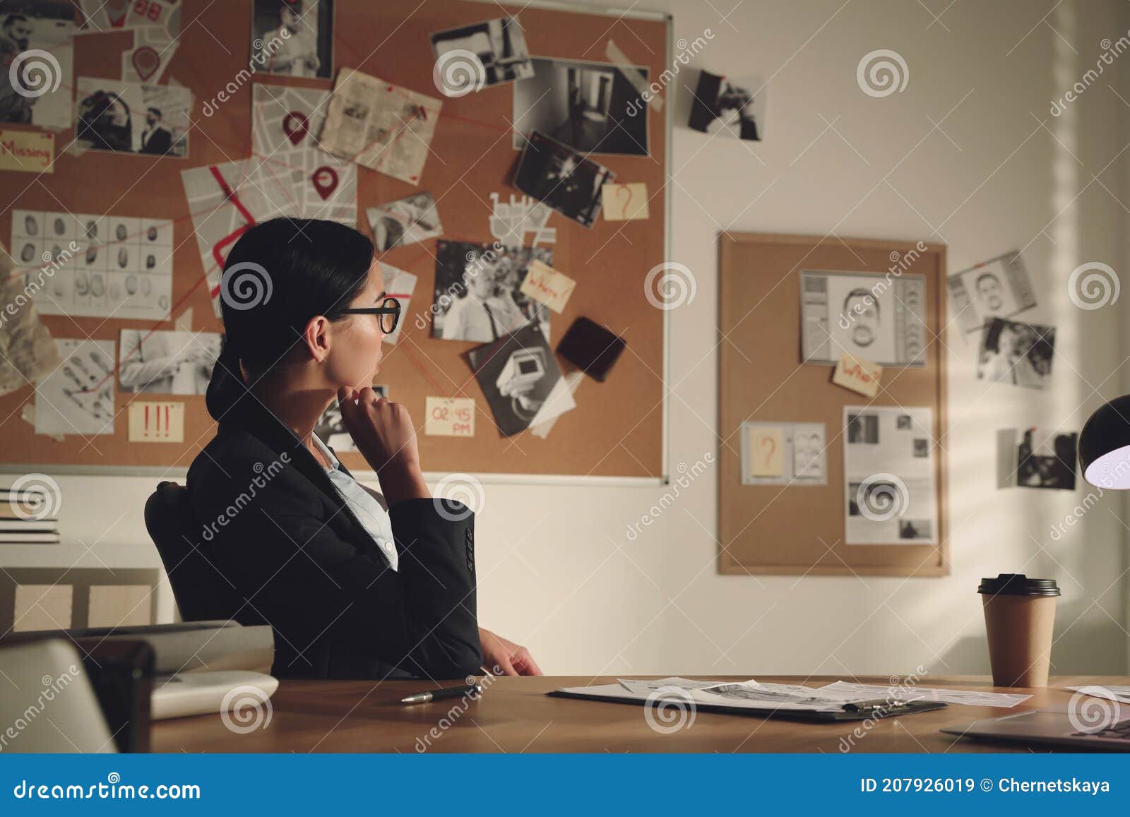 Detective Working At Desk In Her Office Royalty-Free Stock Photo ...