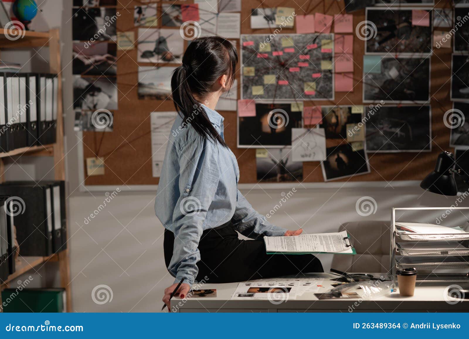 Detective Working at Desk in Her Office. Stock Photo - Image of board ...