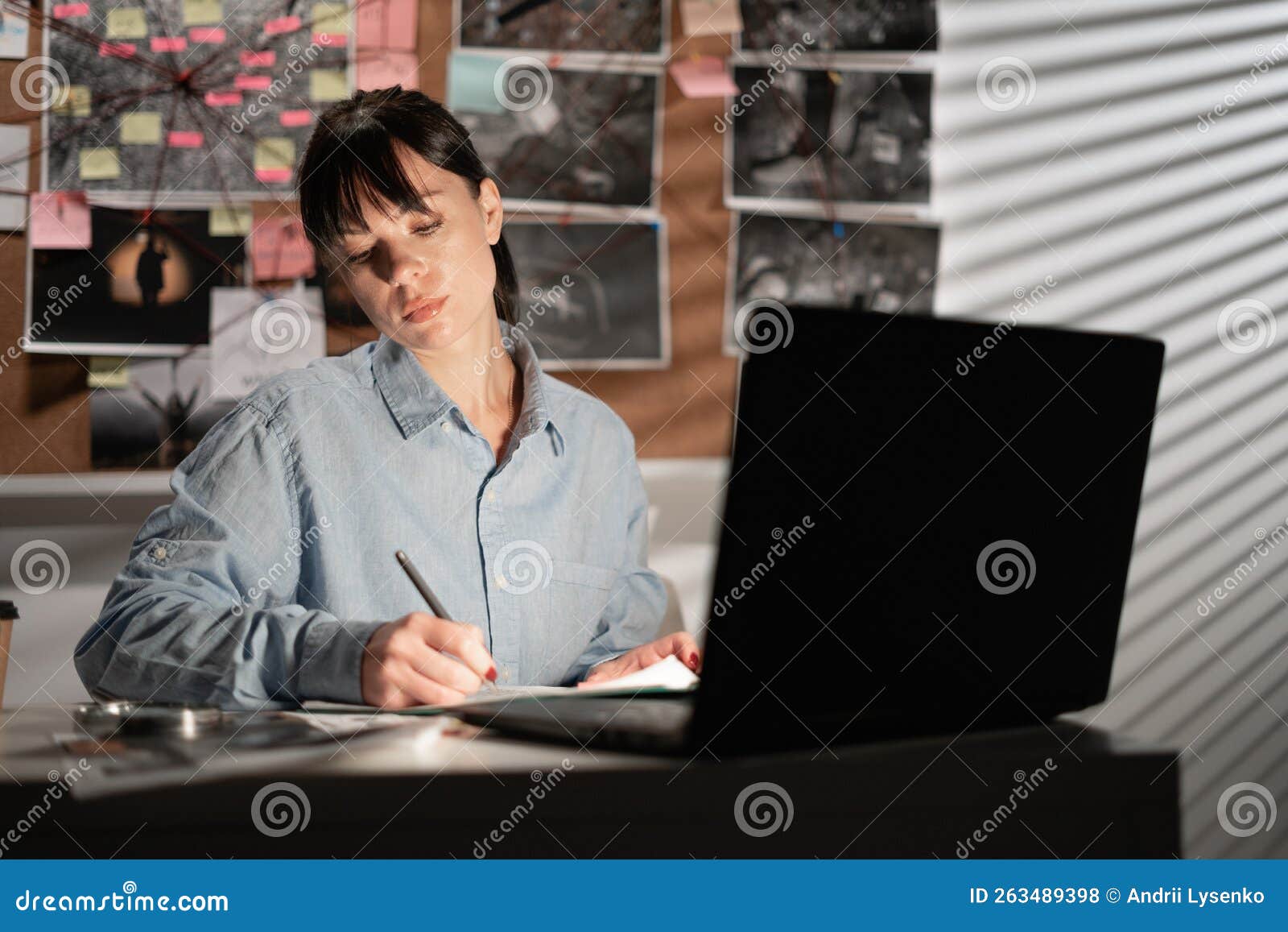 Detective Working at Desk in Her Office, Processing Evidence Stock ...