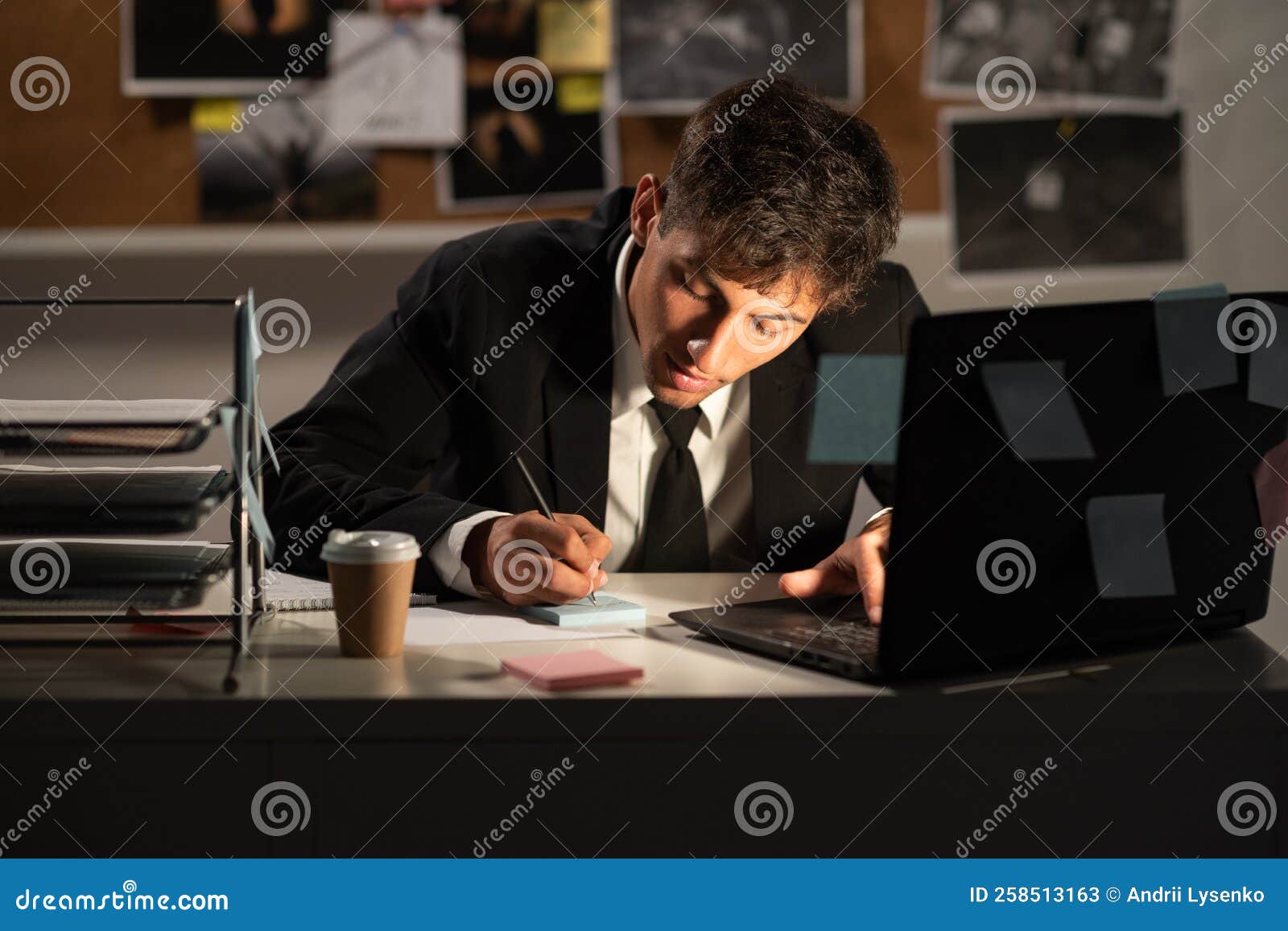 Detective Working at Desk in His Office, Processing Evidence Stock ...