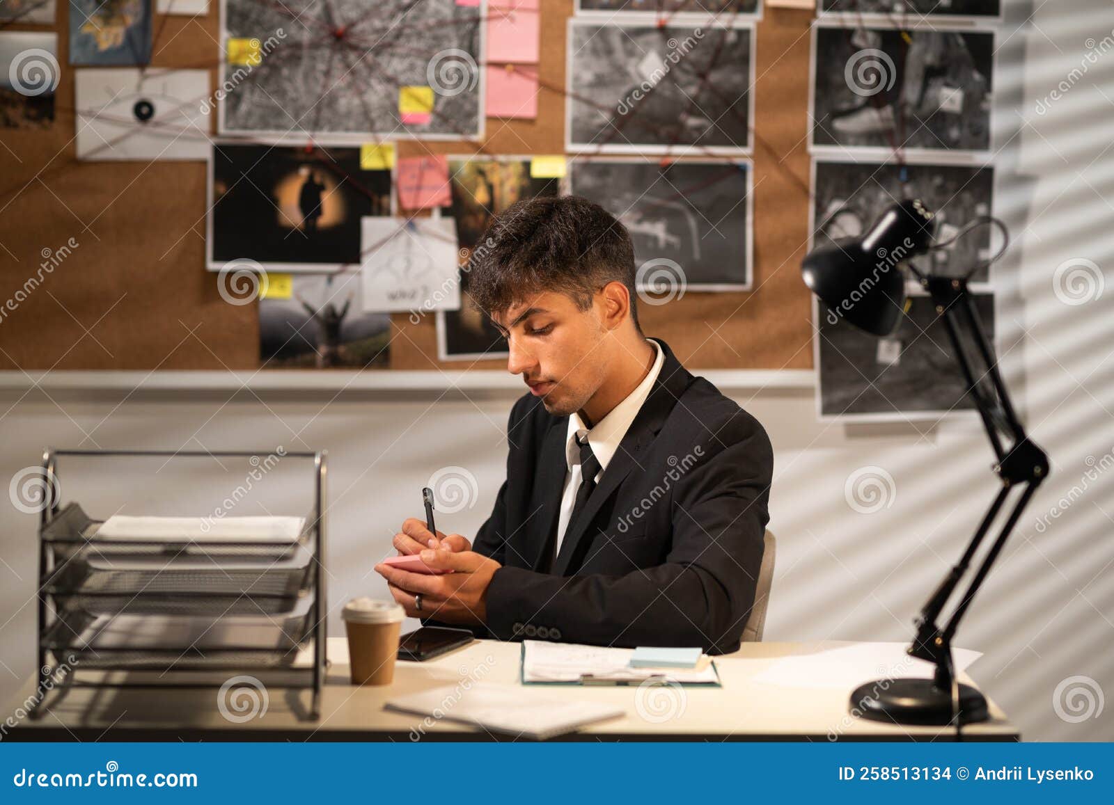 Detective Working at Desk in His Office, Writing Notes Investigation of ...