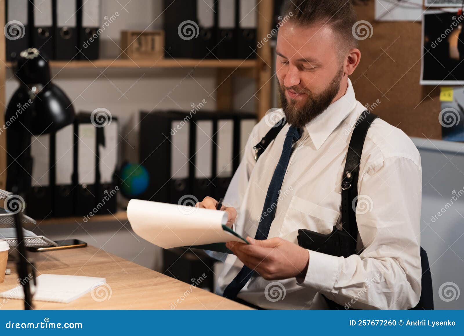 Detective Working with Documents at Desk in His Office Stock Photo ...