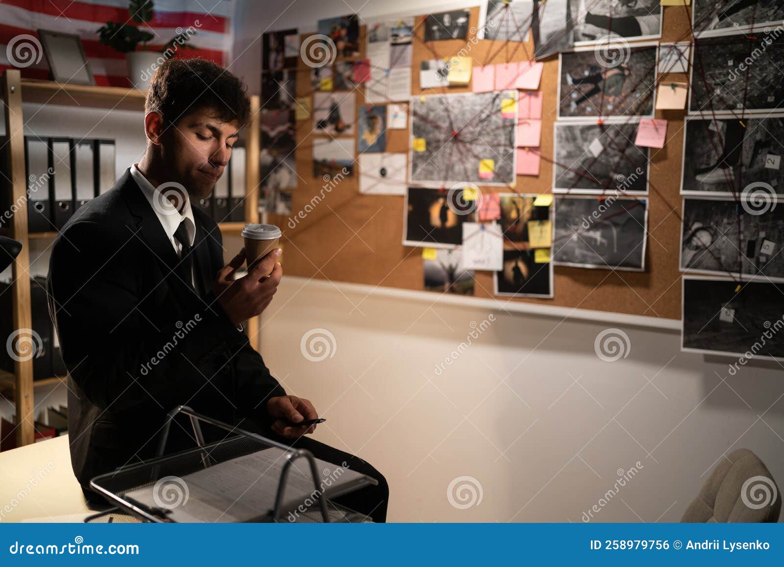 Detective Working in His Office Interior with Evidence Board on Wall ...