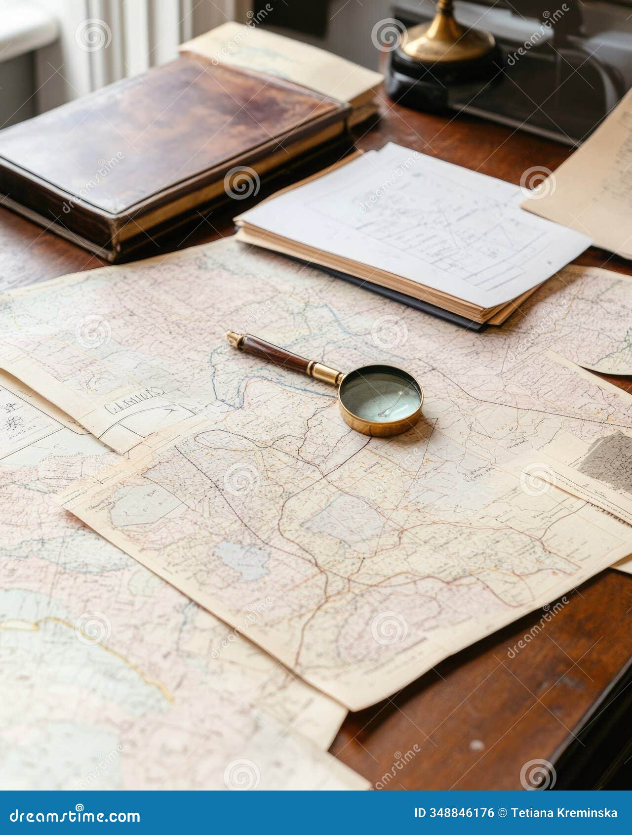 Detectives Desk with Maps and Magnifying Glass Stock Photo - Image of ...