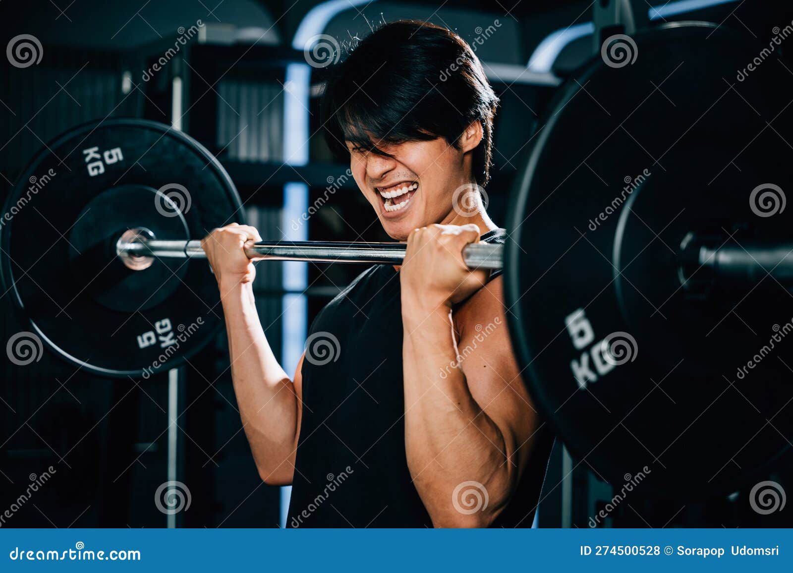 A Determined Bodybuilder Lifting Heavy Barbells in the Gym Stock Photo ...