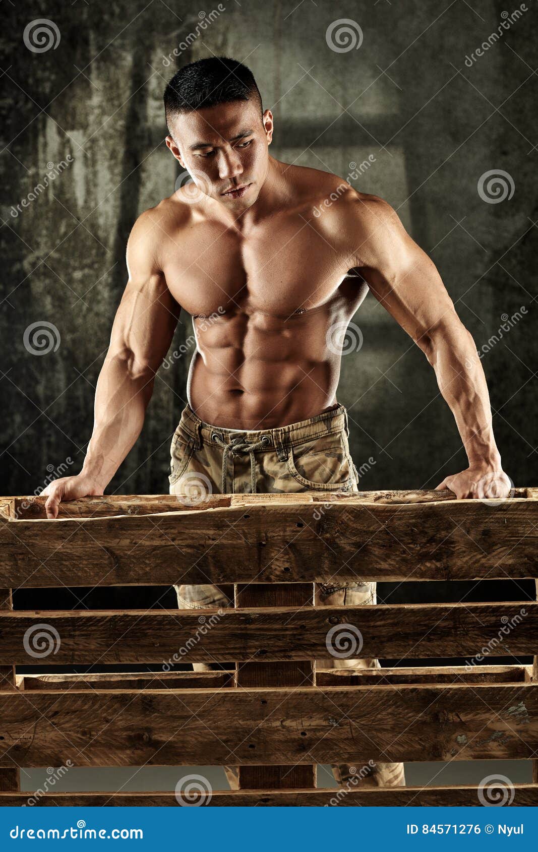 Determined Bodybuilder Standing Behind Pallet Royalty-Free Stock Image ...