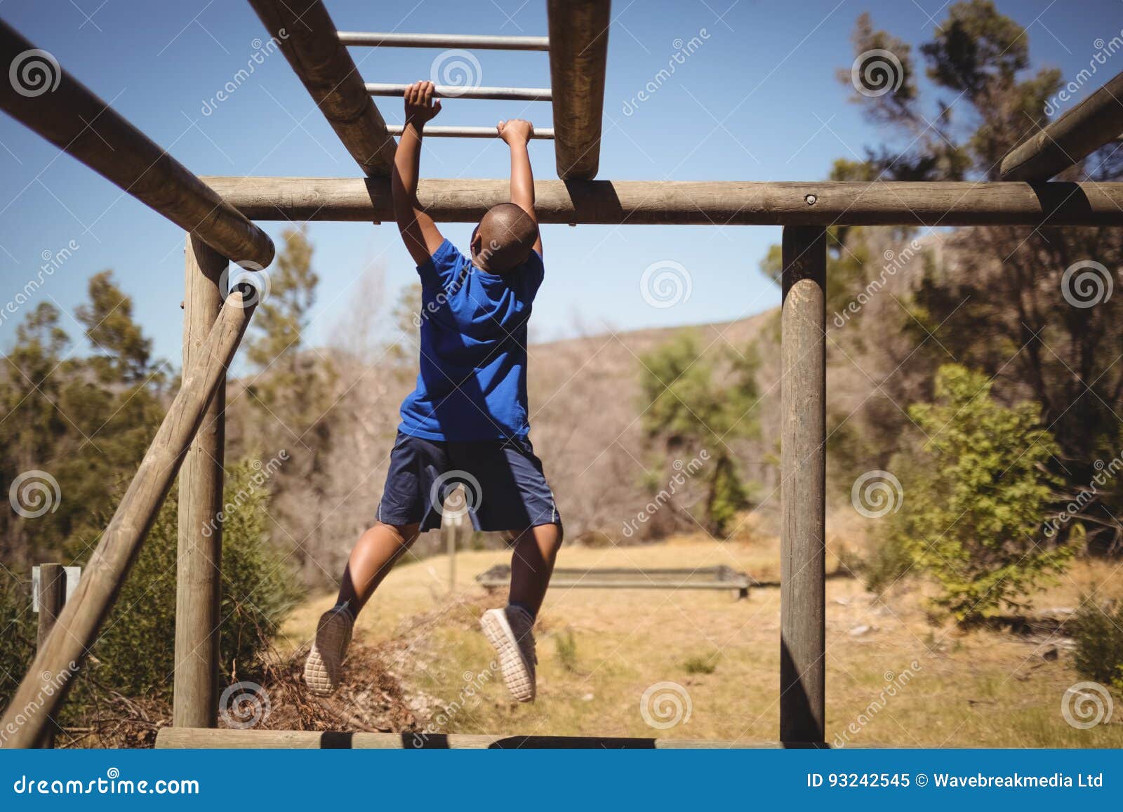 Determined Boy Exercising on Monkey Bar during Obstacle Course Stock ...