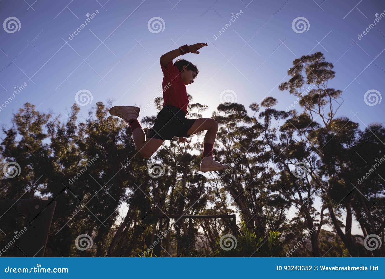 Determined Boy Jumping Over Obstacle Stock Photo - Image of ...
