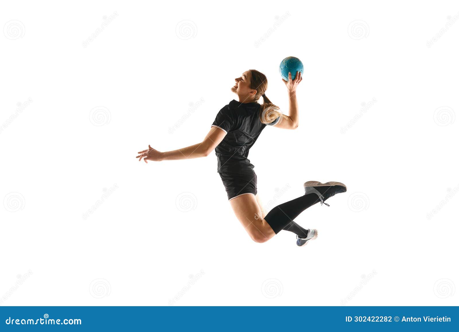 Determined Female Athlete Practicing Handball Moves with Concentration ...