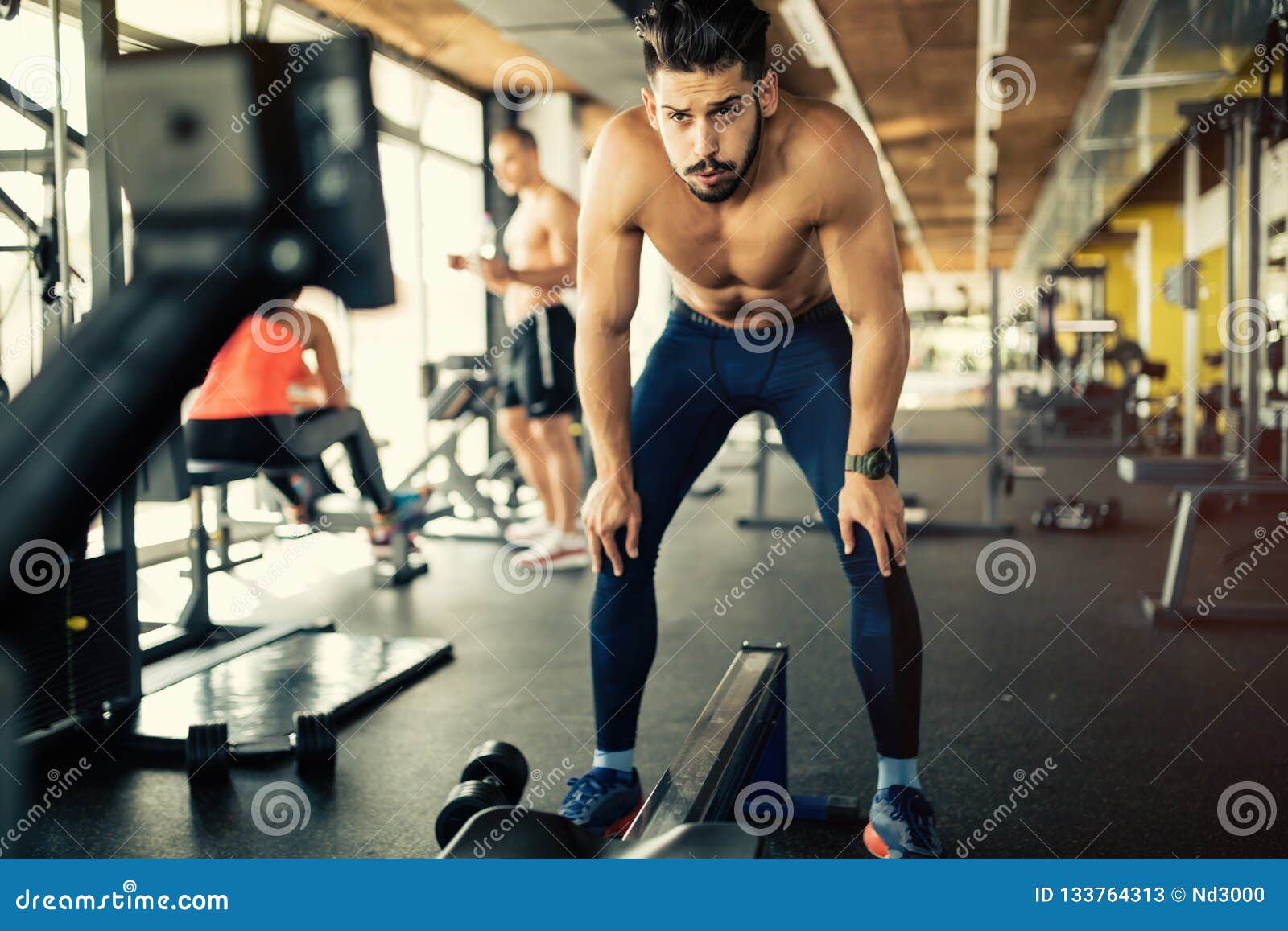 Determined Bodybuilder in Gym Stock Image - Image of male, intense ...
