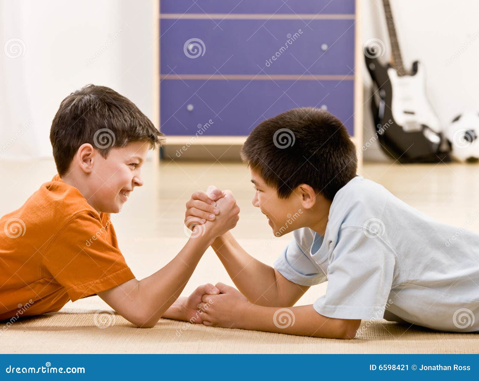 Determined Friends Arm Wrestle Stock Image - Image of competition ...