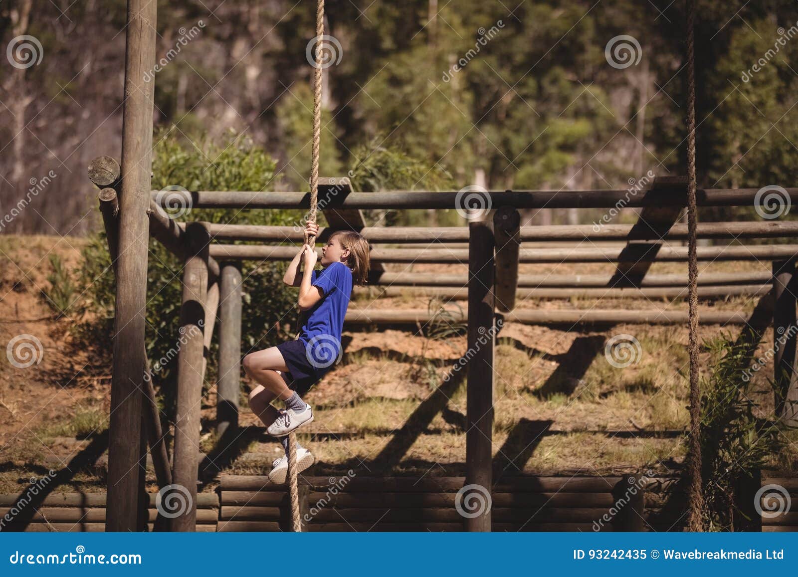 Determined Girl Climbing Rope during Obstacle Course Stock Image ...