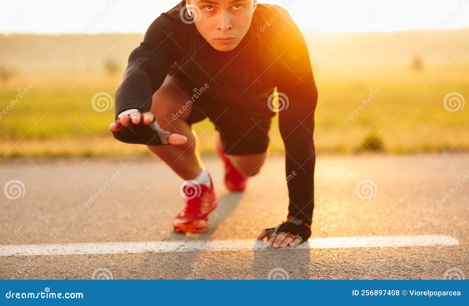 Determined Male Athlete Standing in Crouch Start Position and Getting ...