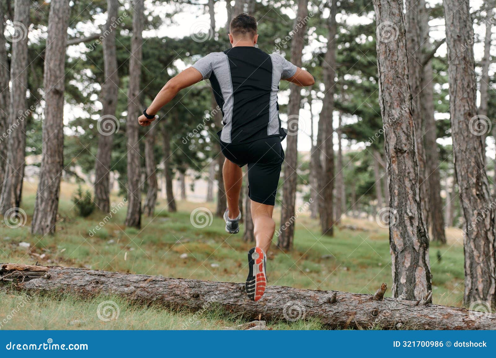 Determined Man Conquering Forest Obstacles with Grit and Speed Stock ...