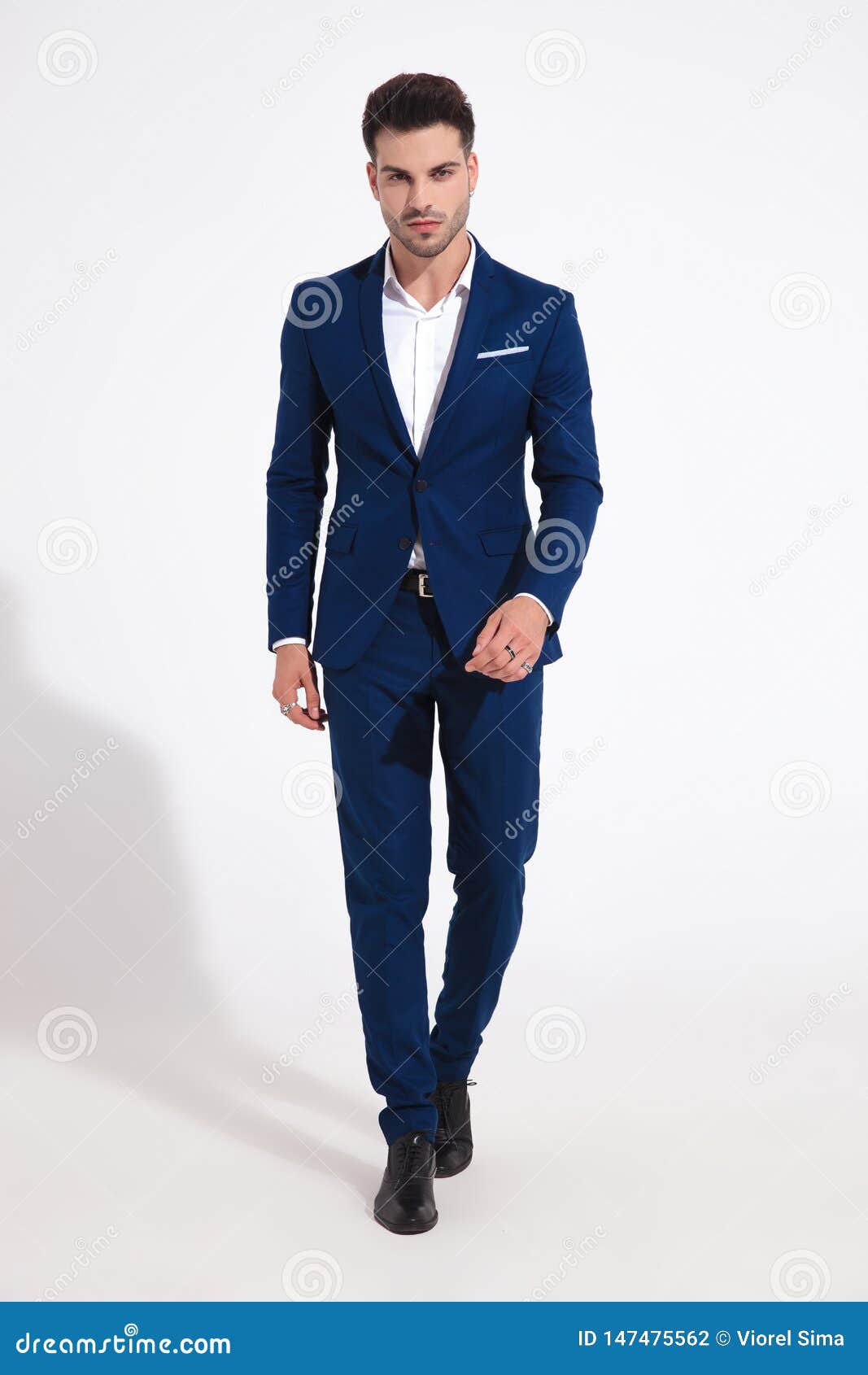 Determined Man Stepping Forward and Looking To the Camera Stock Photo ...