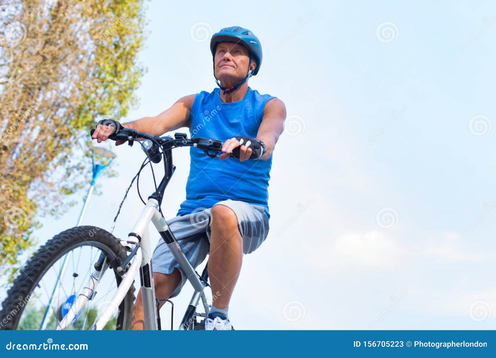 Determined Senior Man Riding Bicycle in Park Stock Image - Image of ...