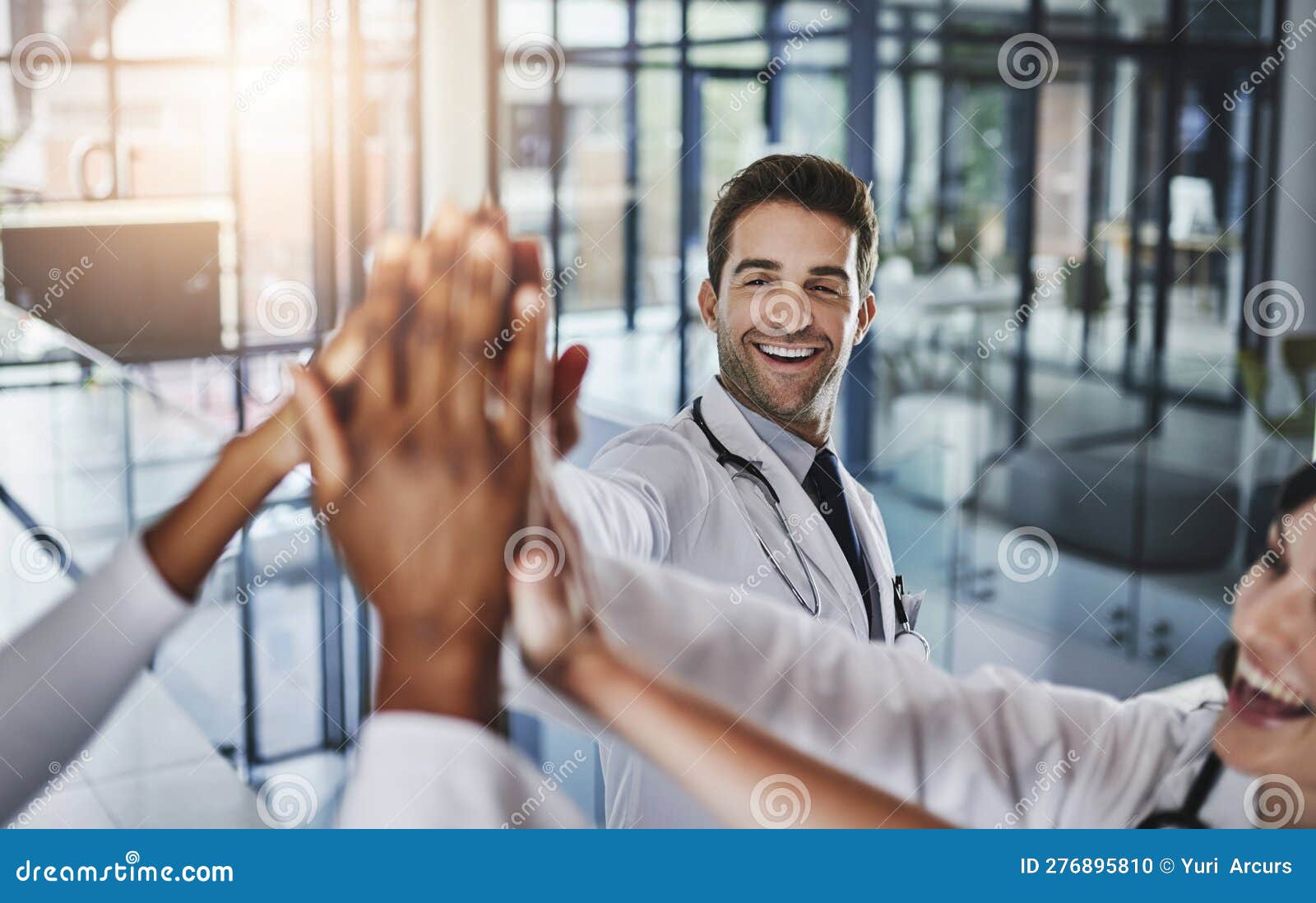 Determined To Make a Difference. a Group of Doctors Joining Their Hands ...