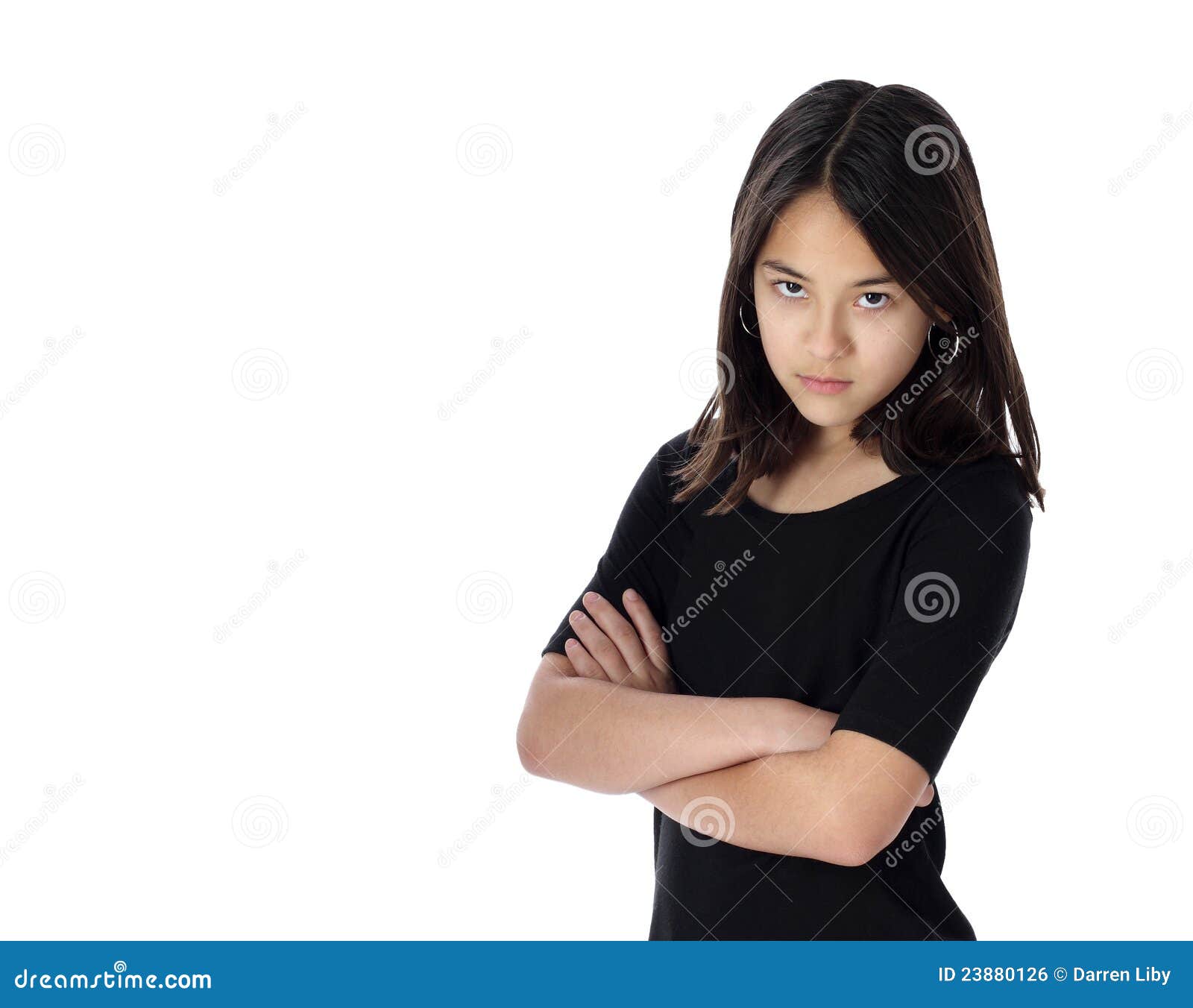 A Determined Young Girl Glares Stock Photo - Image of arms, terse: 23880126