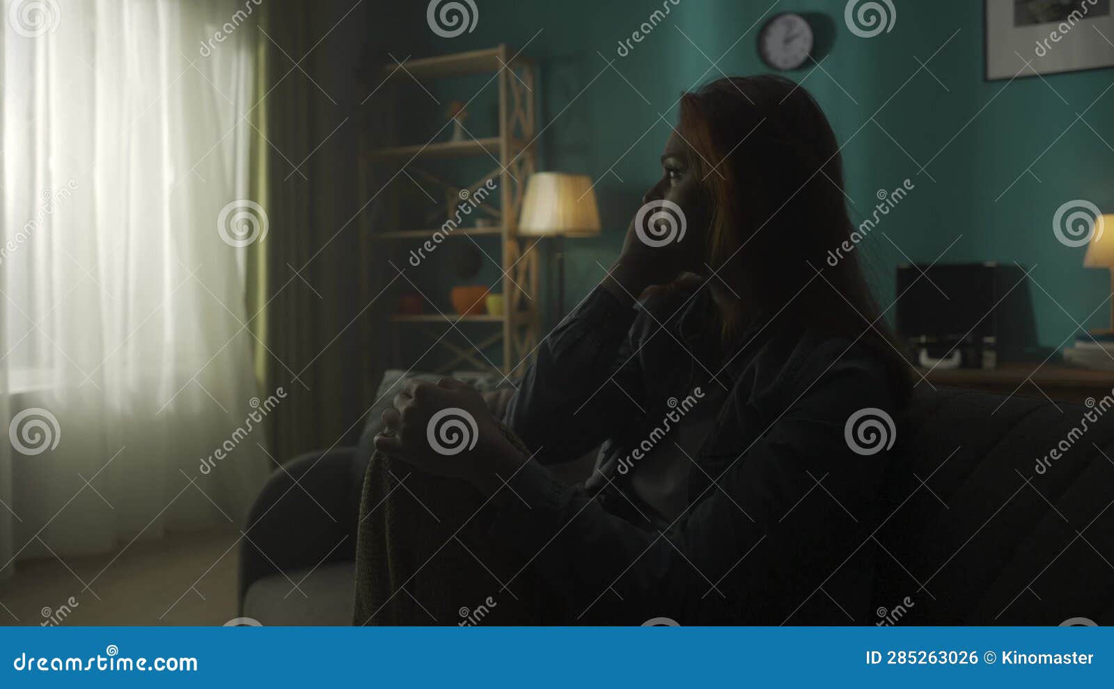 Devastated Woman Sitting on a Sofa in a Dark Room Close Up. a Woman ...