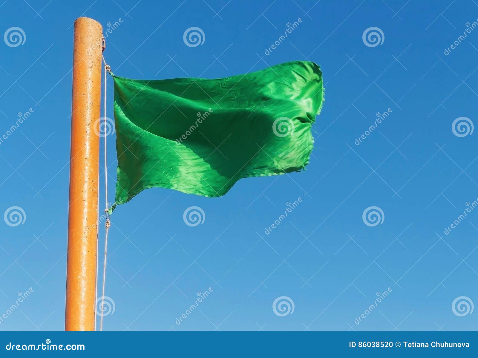 Develop Green Flag on a Background of Blue Sky Stock Photo - Image of ...