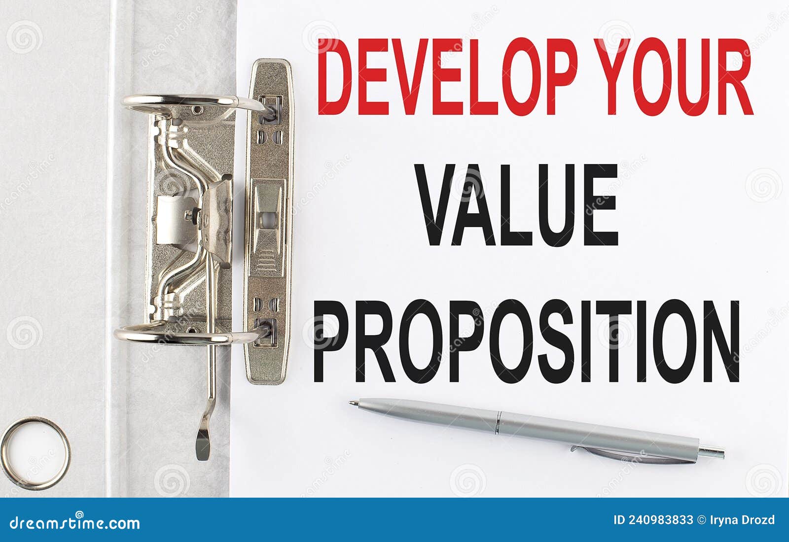 DEVELOP YOUR VALUE PROPOSITION Text on the Paper Folder with Pen ...