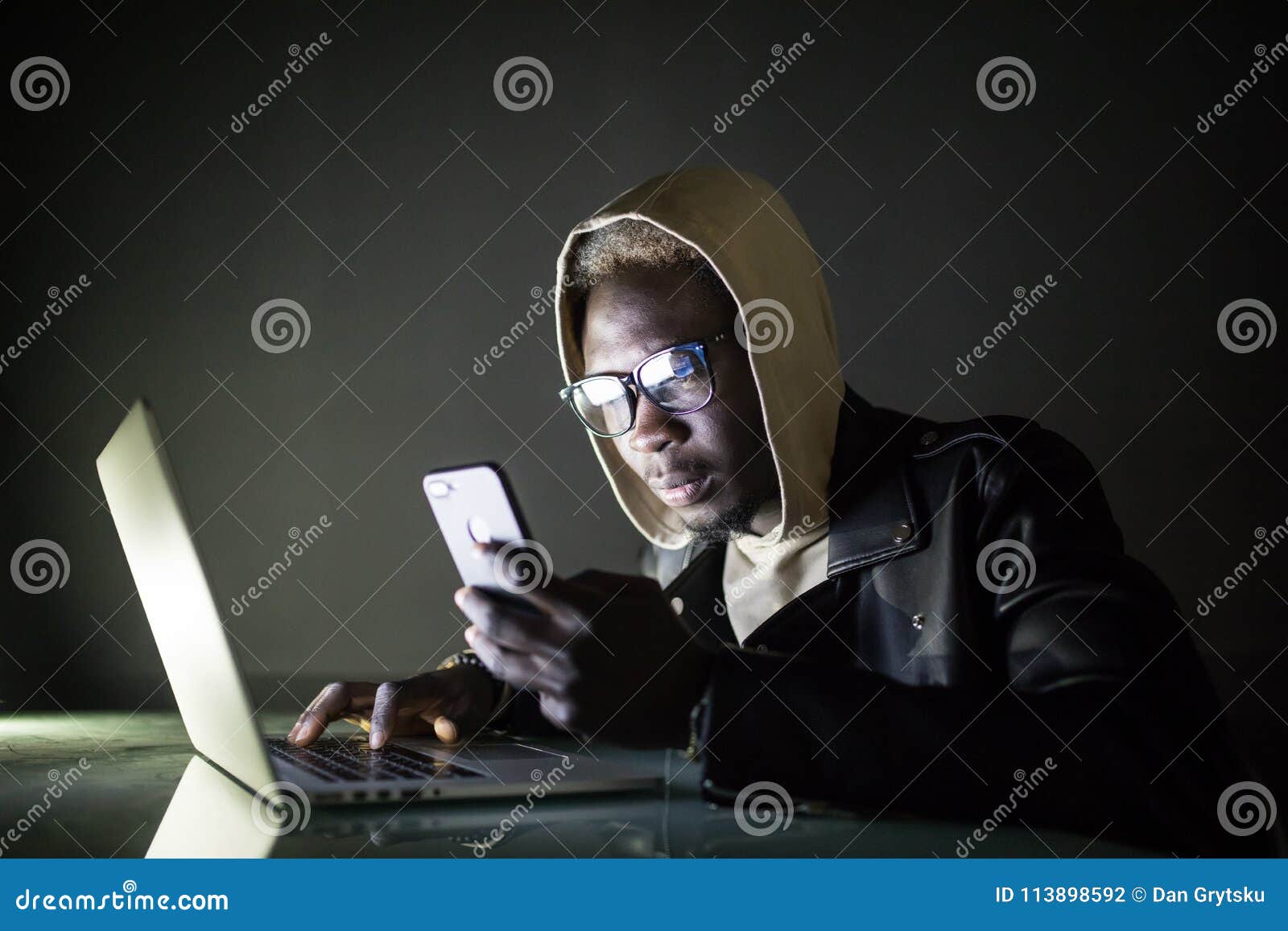 The Developer is Developing the Software on His Laptop in the Night ...